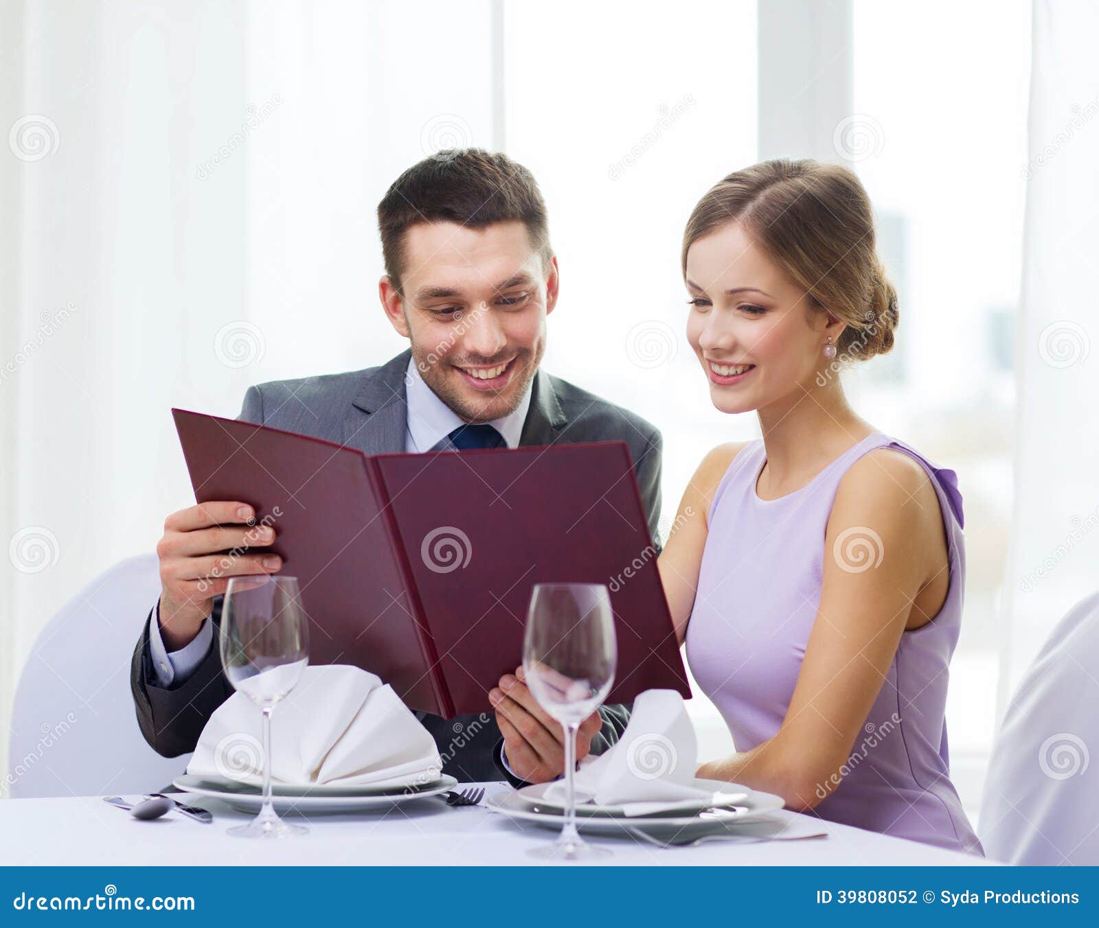 Smiling Couple with Menu at Restaurant Stock Photo - Image of meal ...
