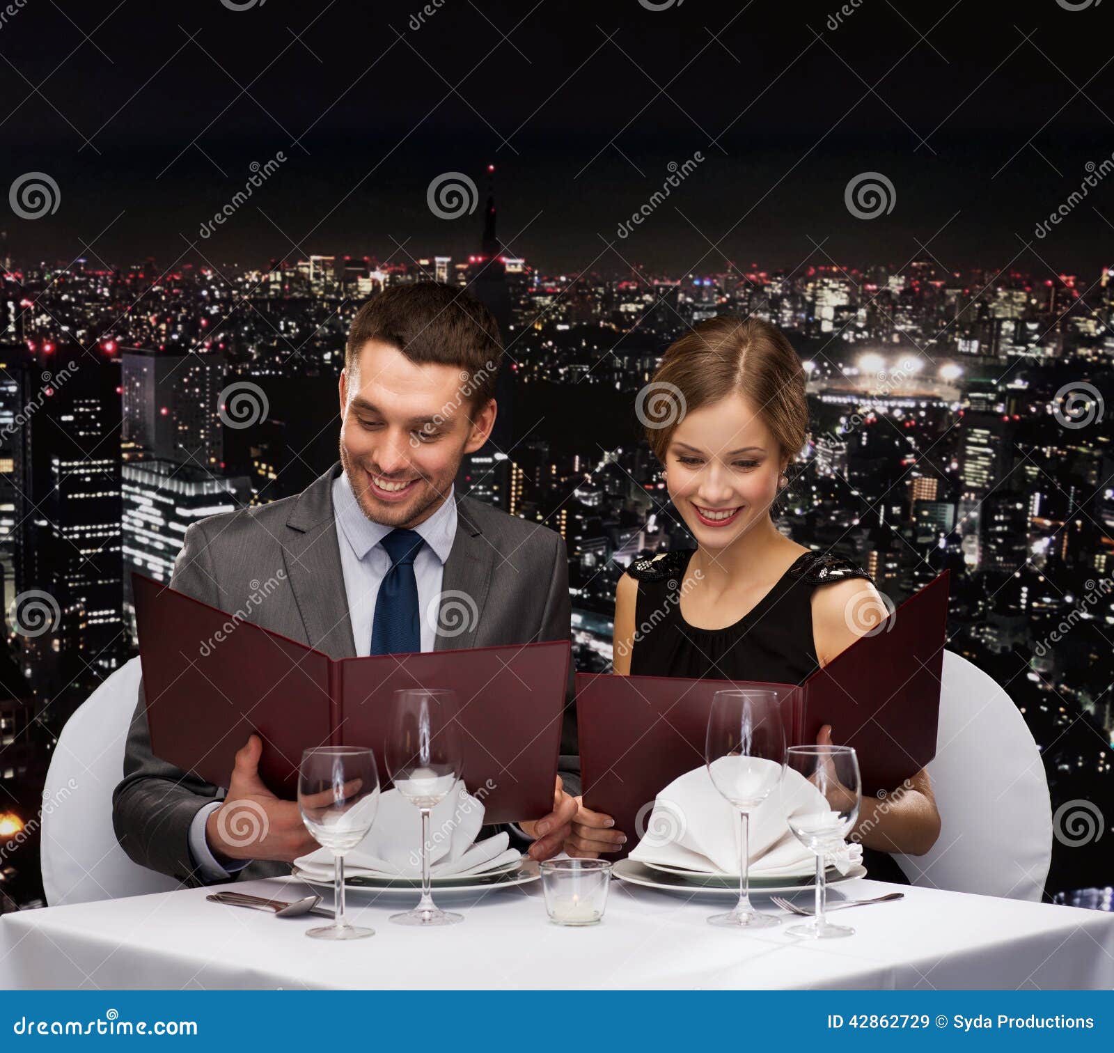 Smiling Couple with Menus at Restaurant Stock Image - Image of menu ...