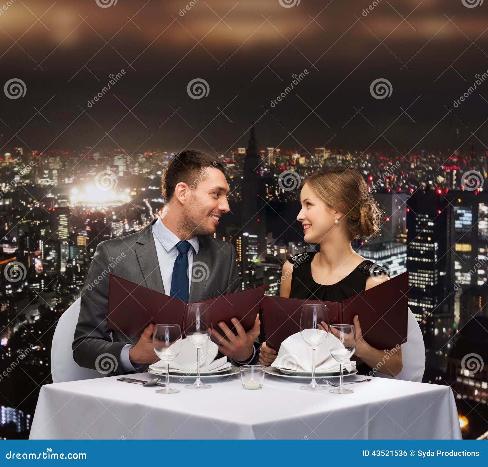 Smiling Couple with Menus at Restaurant Stock Photo - Image of ...