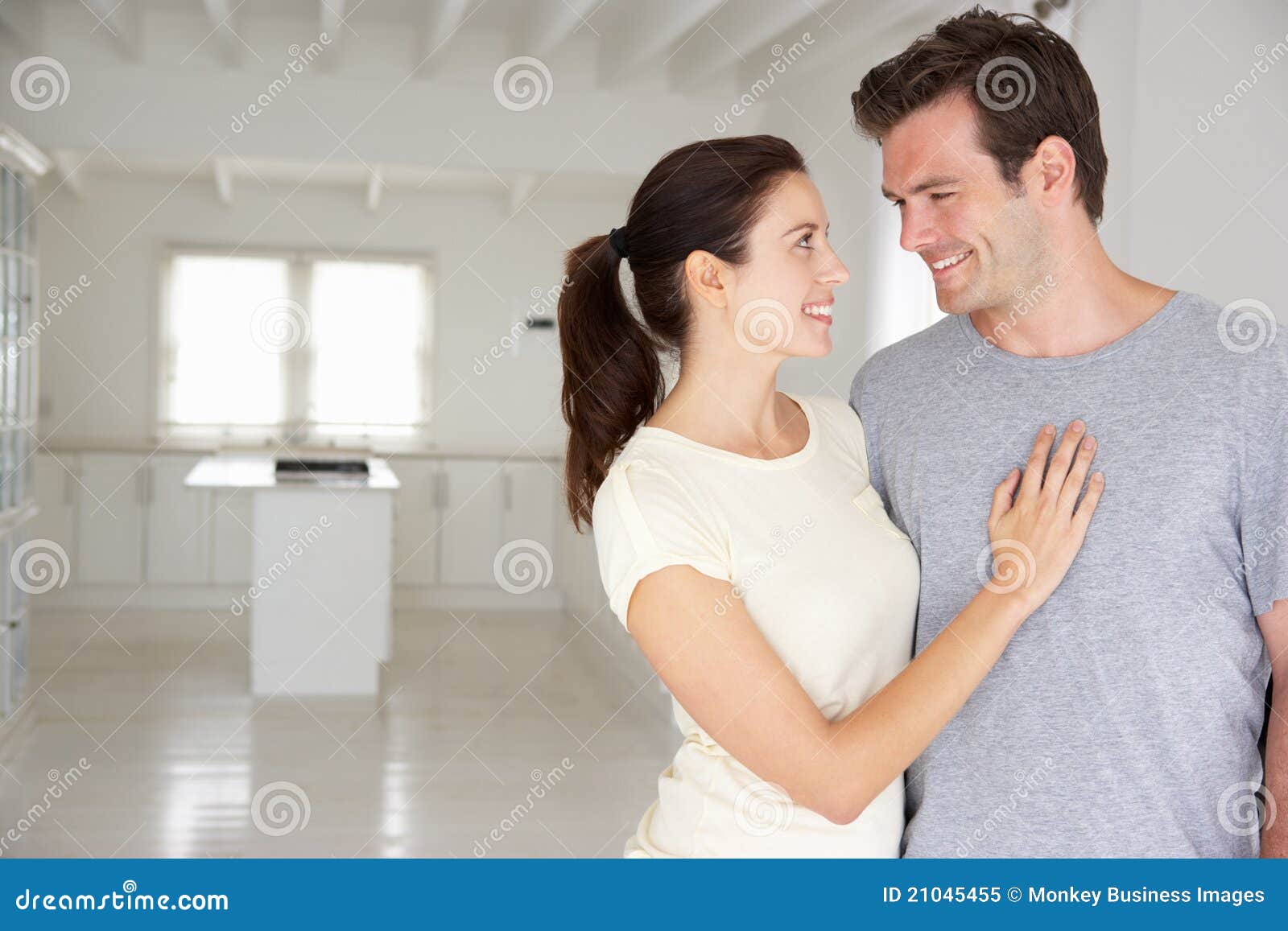 Smiling couple in new home stock image. Image of people - 21045455