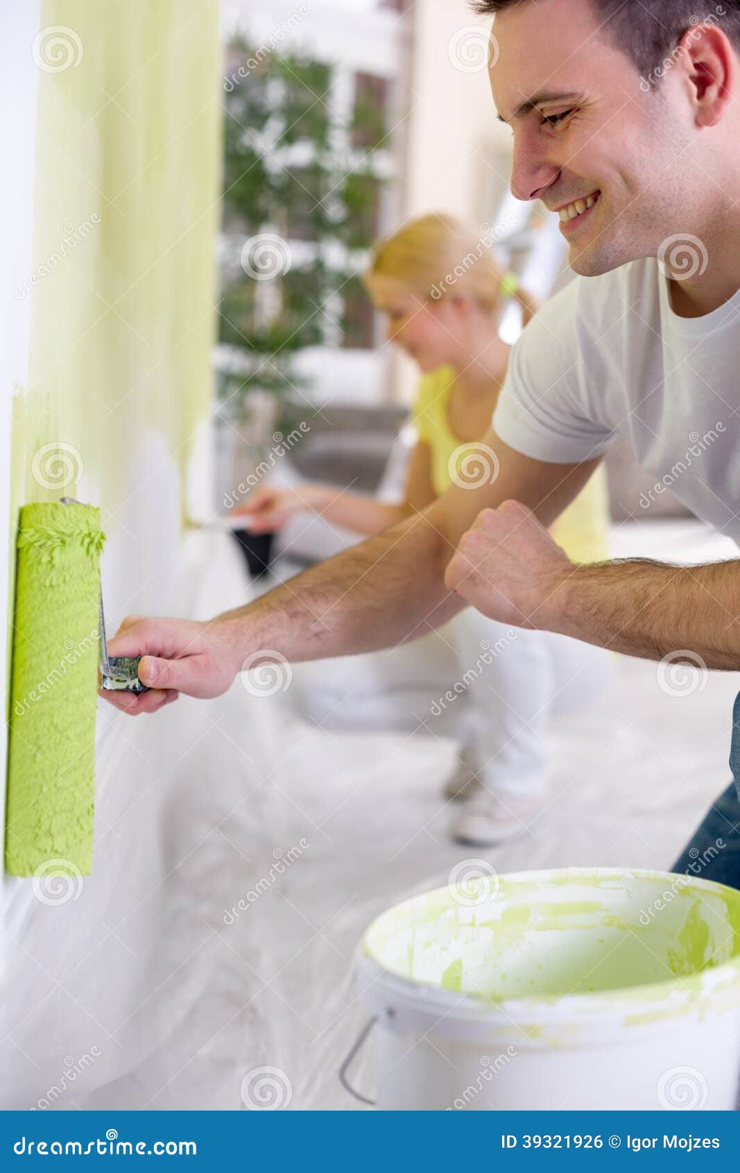 Smiling couple painting stock photo. Image of moving - 39321926