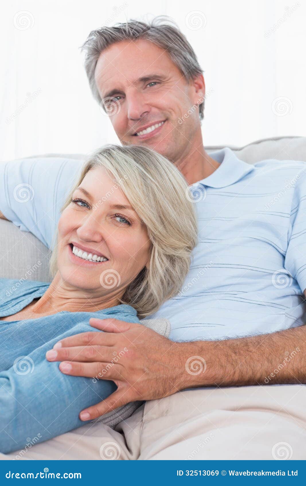 Smiling Couple Relaxing at Home Stock Image - Image of female, male ...