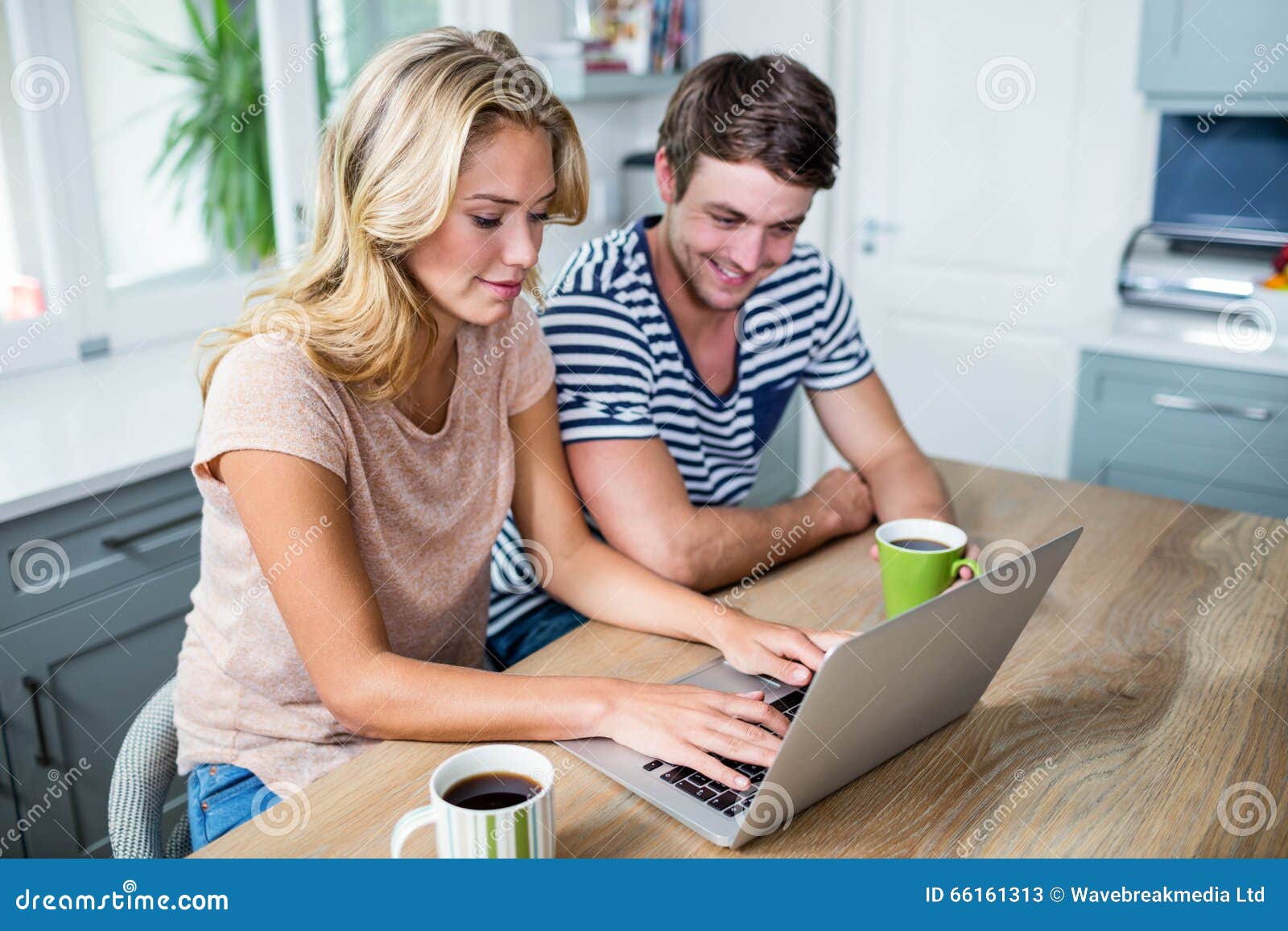 Smiling Couple Typing on Laptop Stock Image - Image of computer ...
