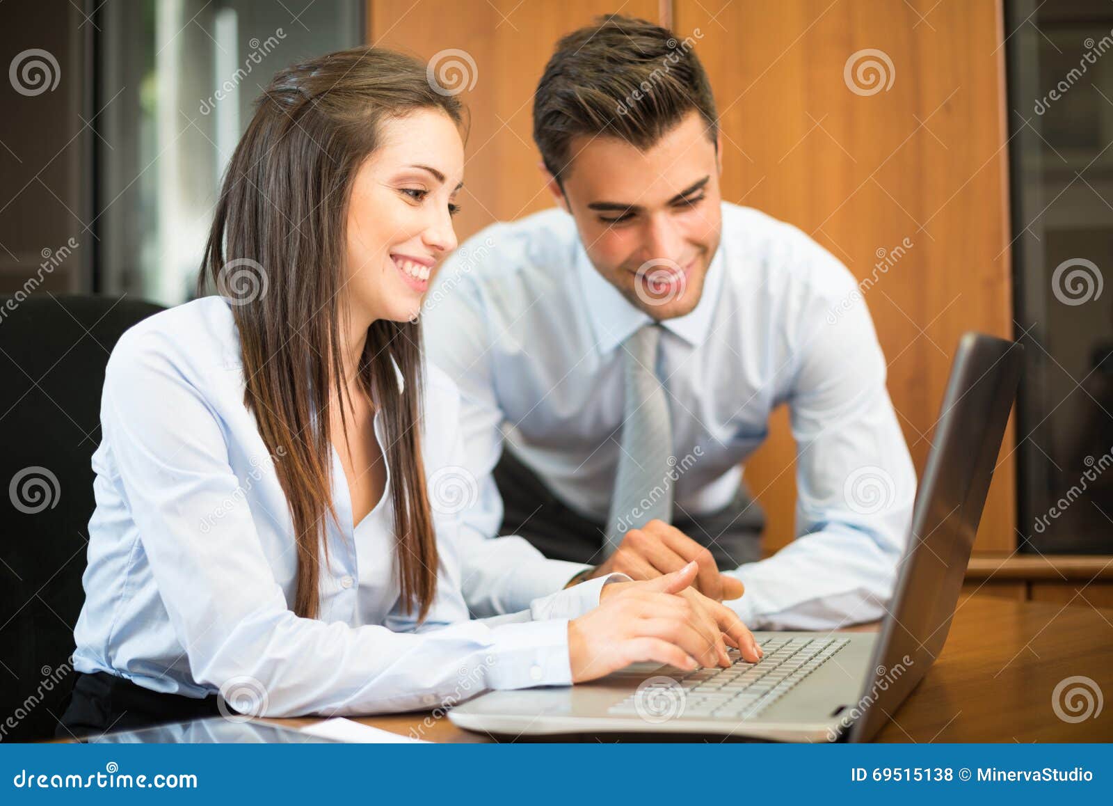 Smiling Couple Using a Laptop Computer Stock Photo - Image of ...