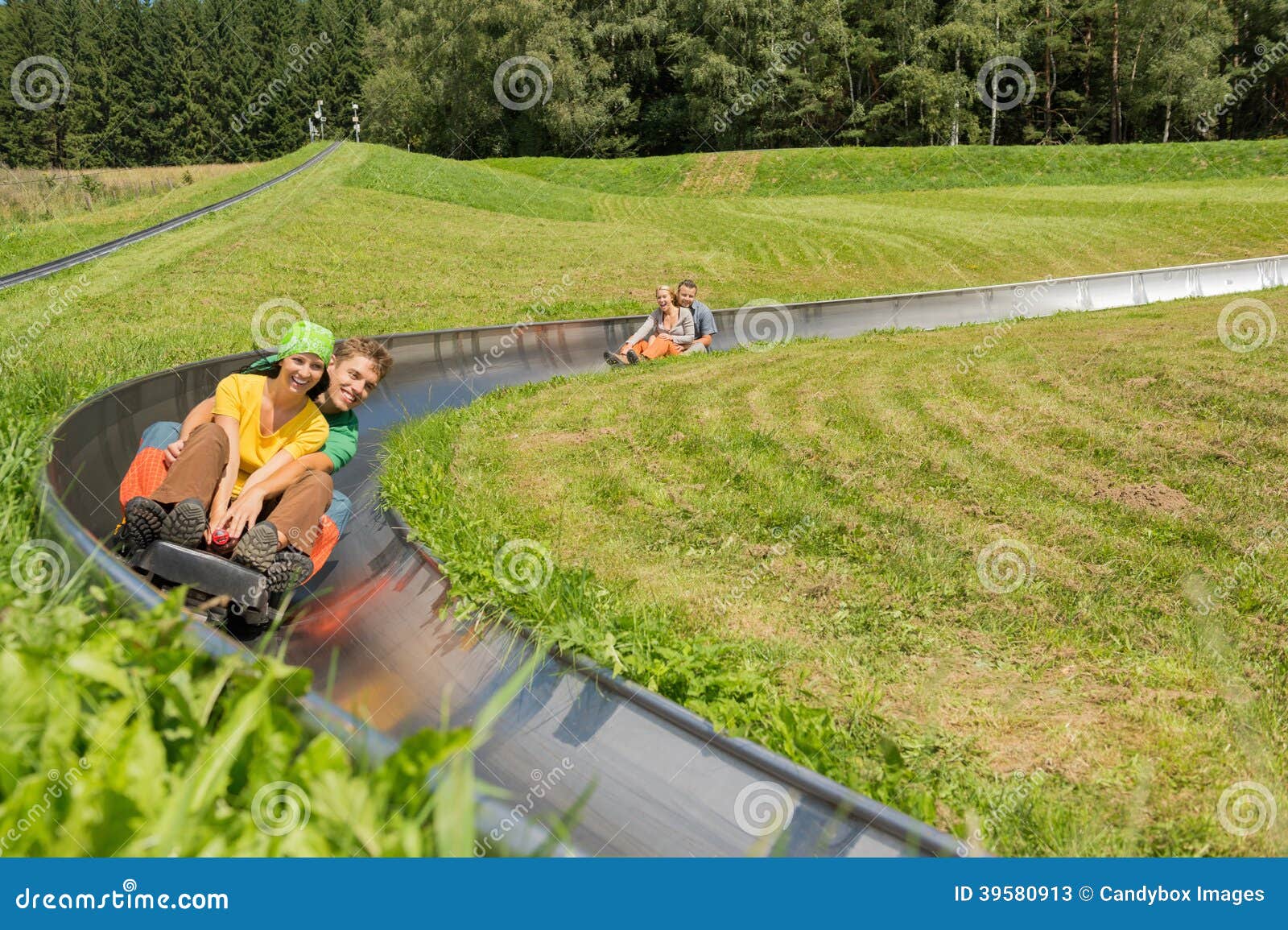 Smiling Couples Enjoying Summer Sledge Stock Image - Image of alpine ...