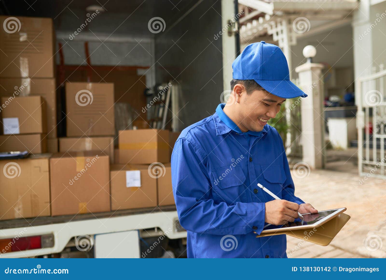 Smiling Courier Sighing Document Stock Photo - Image of cheerful ...