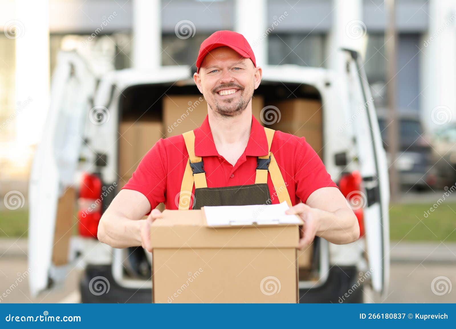 Smiling Courier Stands in Front of Van with Parcel Stock Image - Image ...