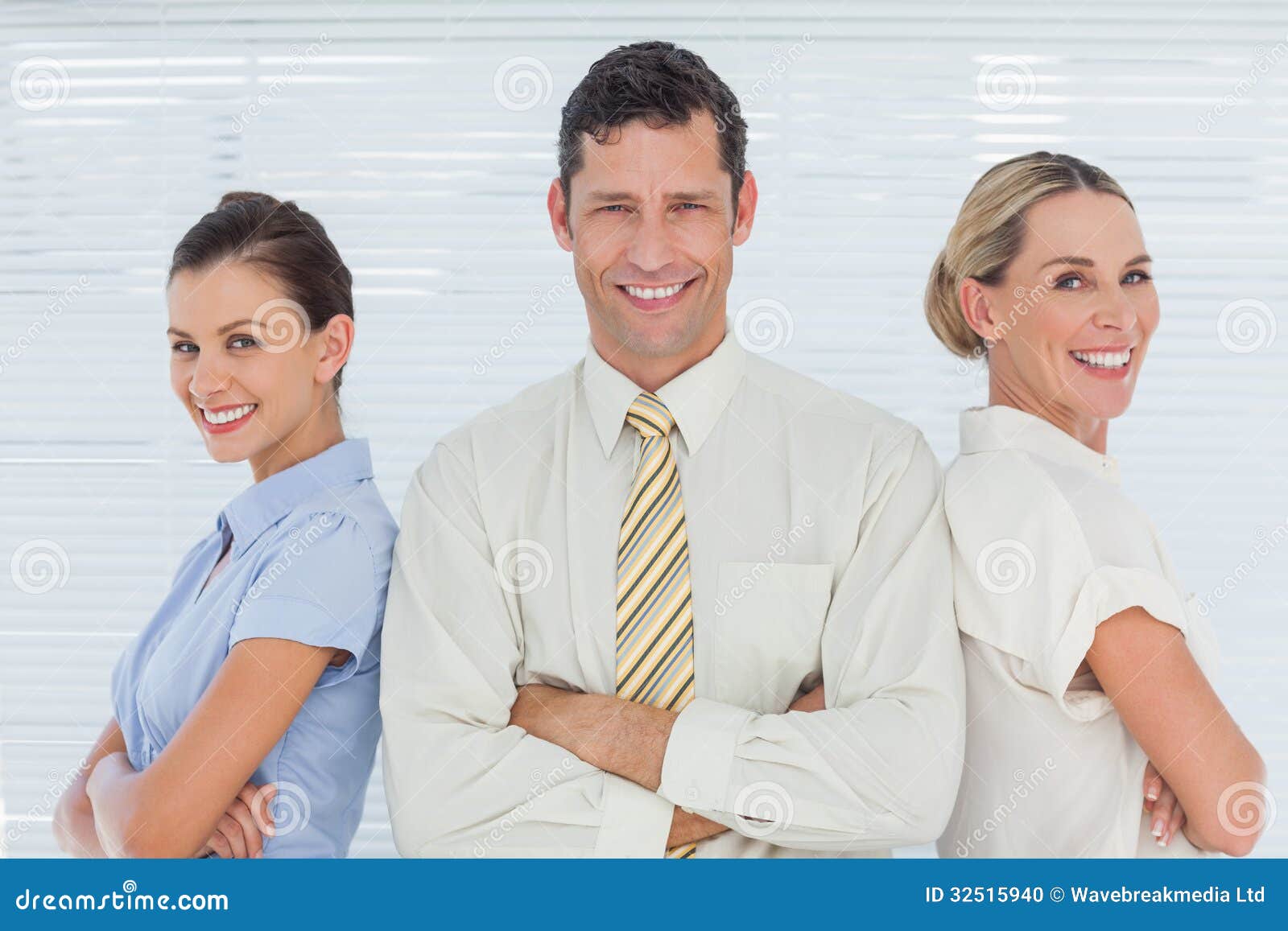 Smiling Coworkers Posing Together Stock Photo - Image of arms ...