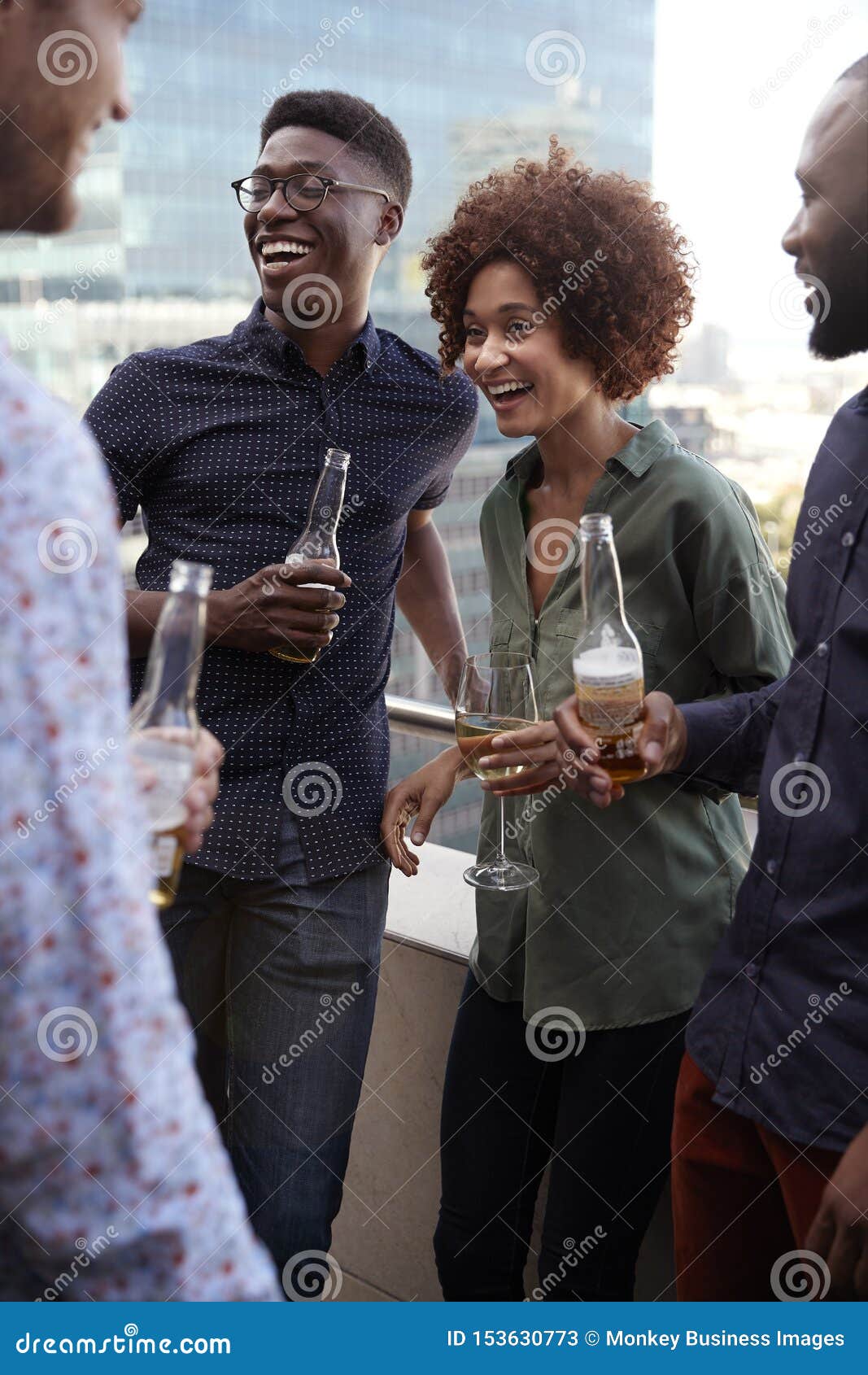Smiling Creative Business Colleagues Socialising with Drinks after Work ... Smiling Creative Business Colleagues Socialising with Drinks after Work ...