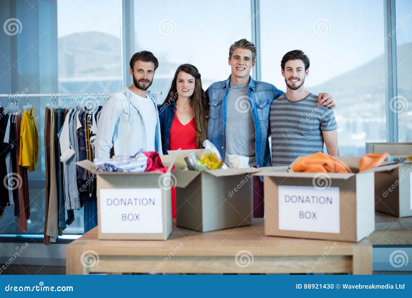 Smiling Creative Business Team Standing Together with Donation Box ...