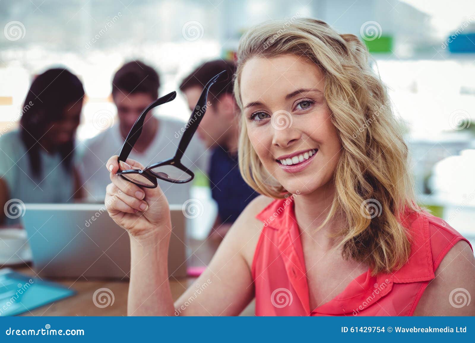 Smiling Creative Businesswoman Working with Co-workers Stock Photo ...