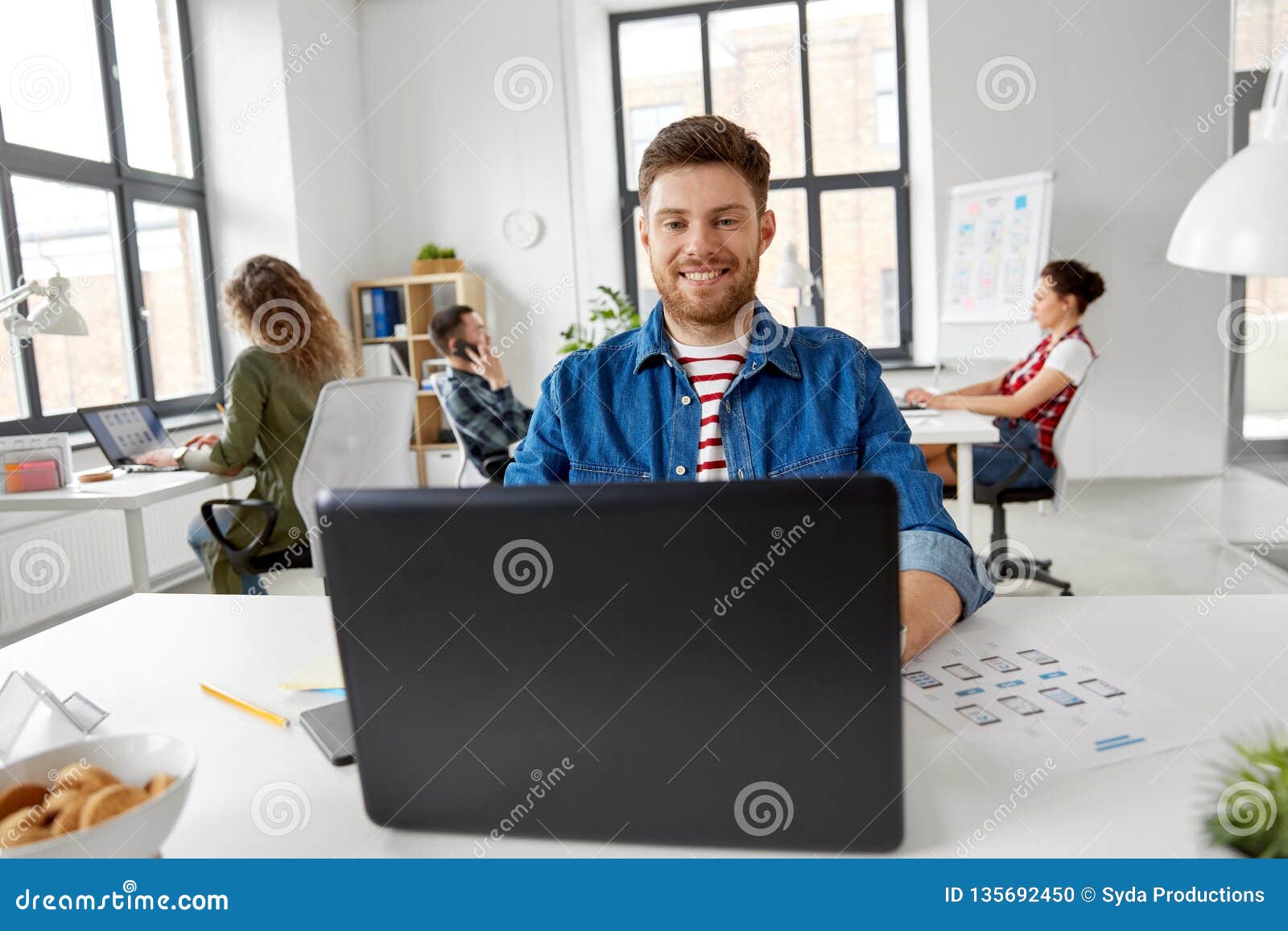 Smiling Creative Man with Laptop Working at Office Stock Photo - Image ...