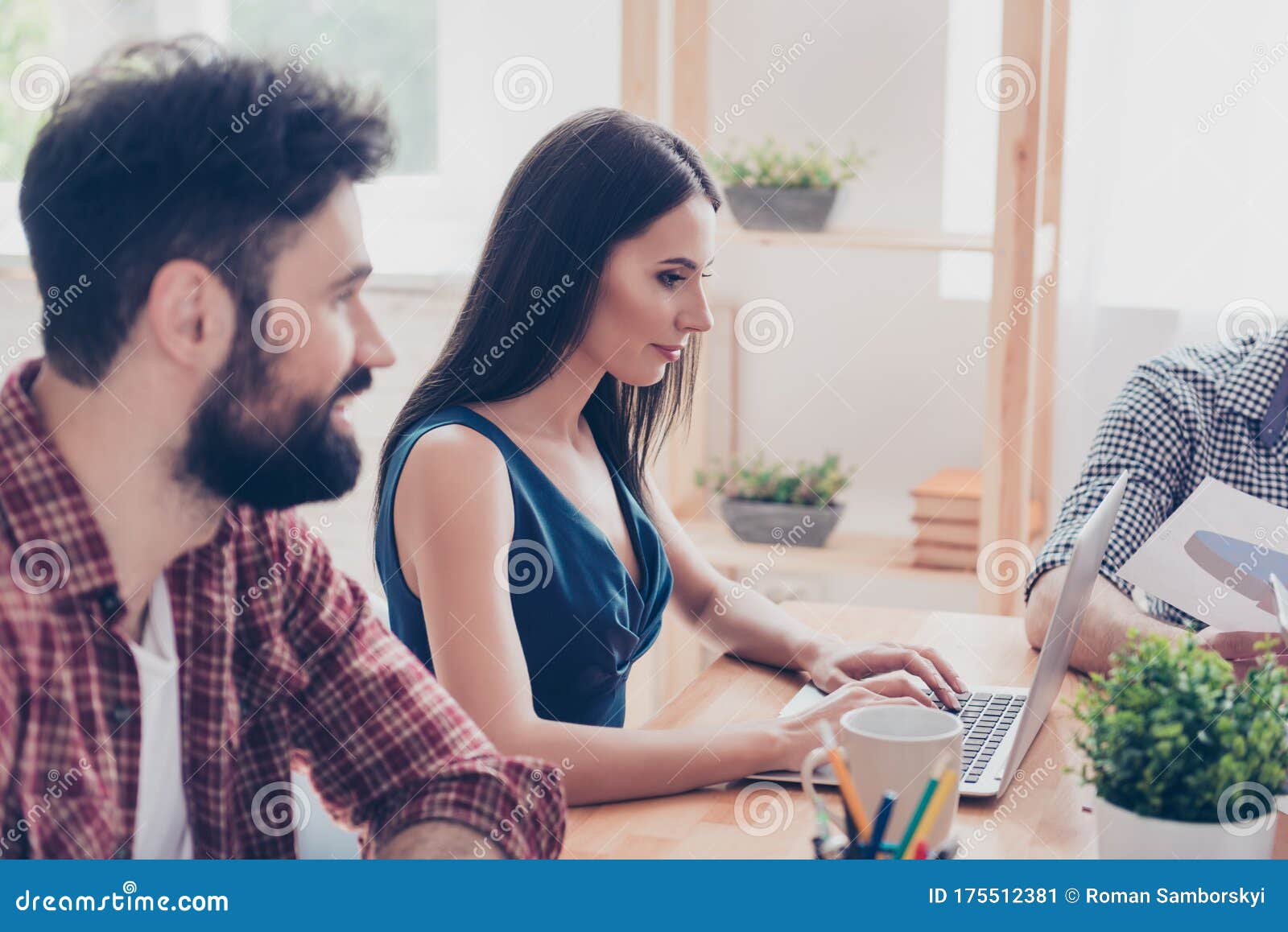 Smiling Creative Team with Laptop Working Hard in Office Stock Image ...