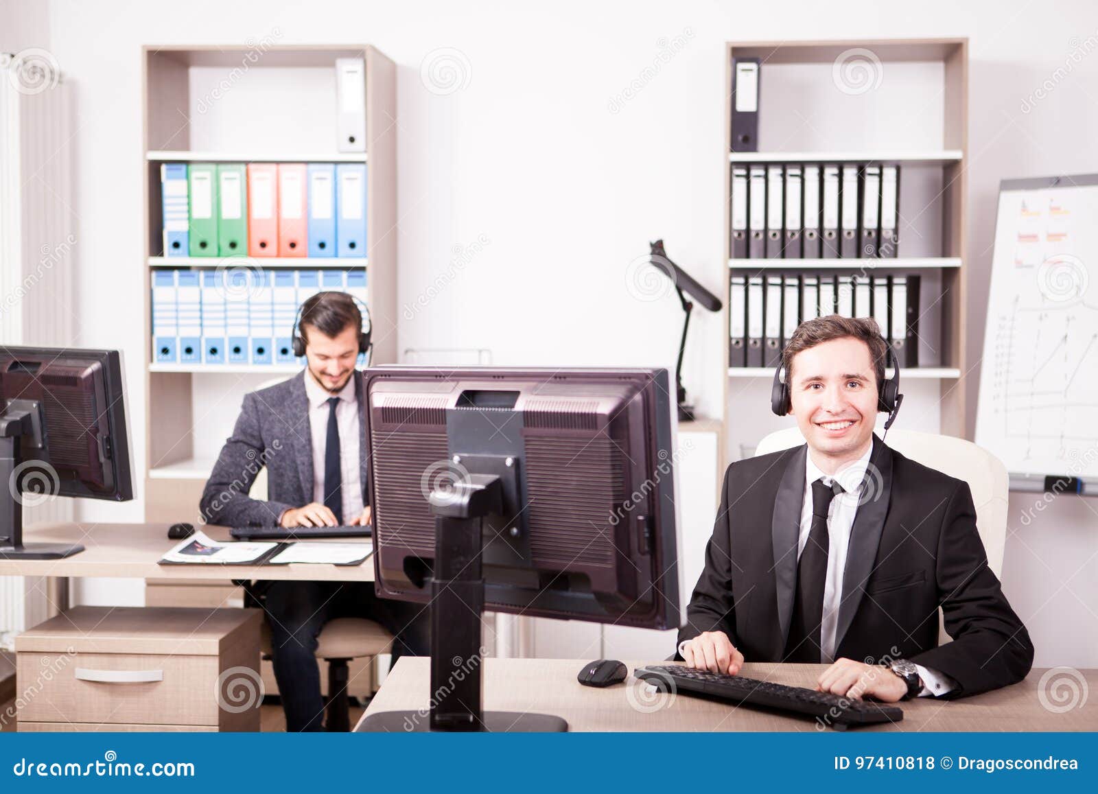 Smiling Customer Service Support Working in the Office Stock Photo ...
