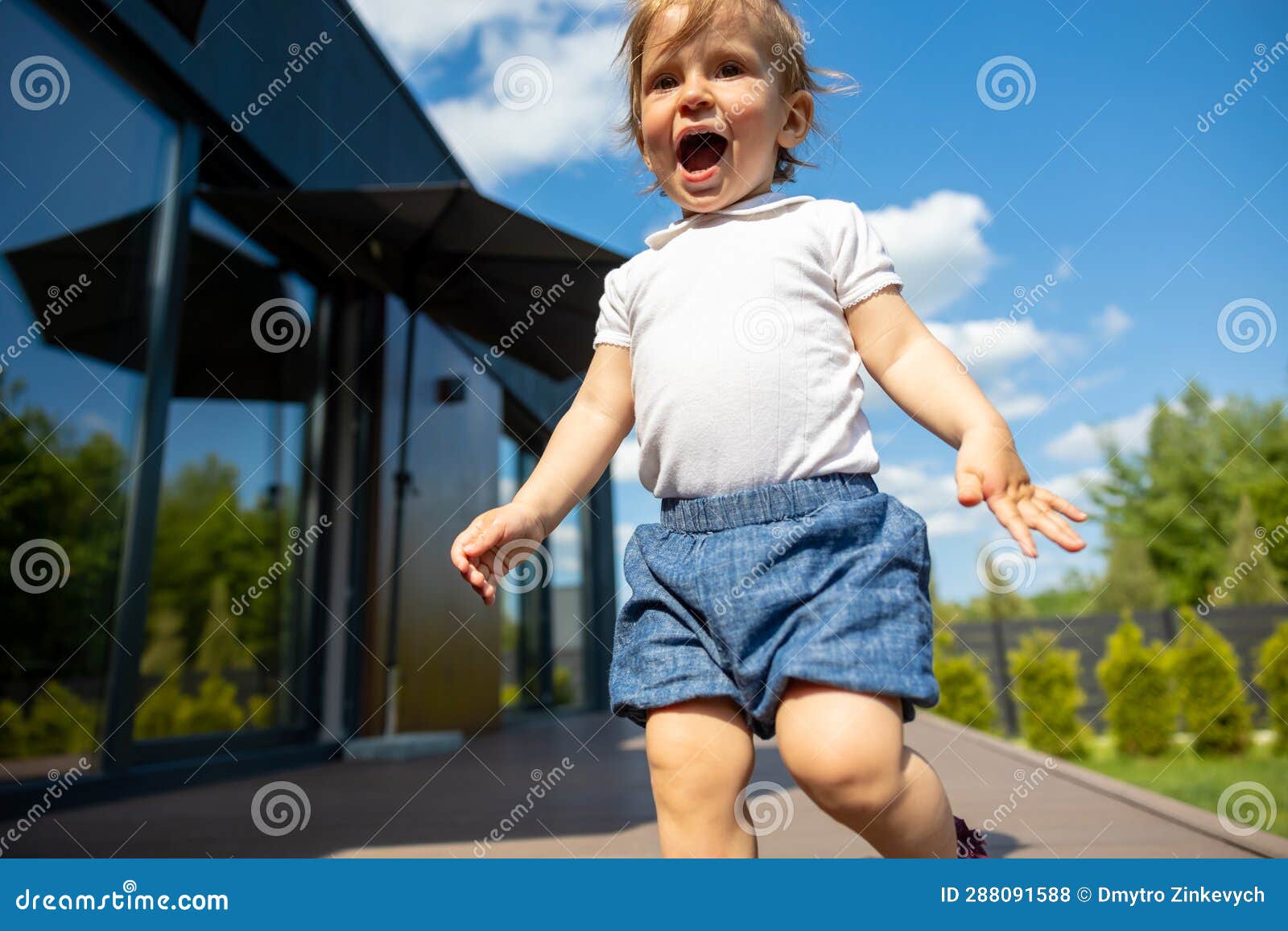 Smiling Cute Kid Walking and Looking Excited Stock Photo - Image of ...
