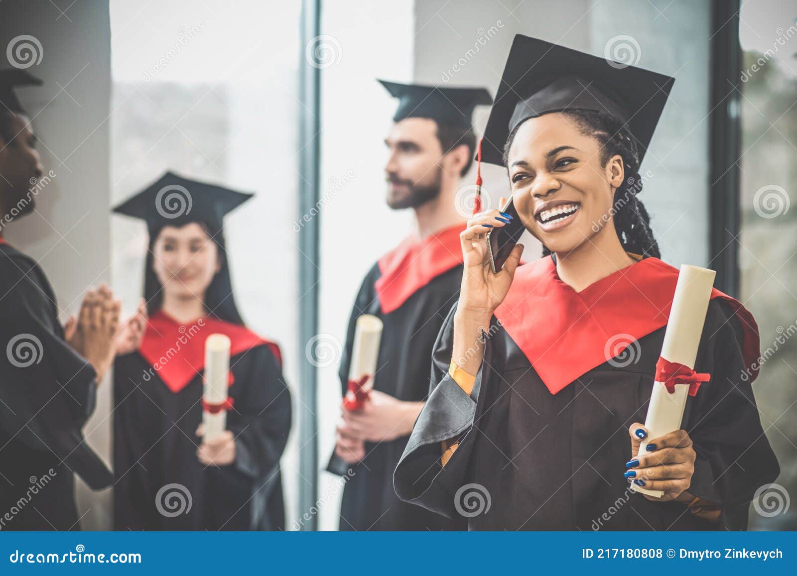 Smiling Dark-skinned Graduate Talking on the Phone Stock Photo - Image ...