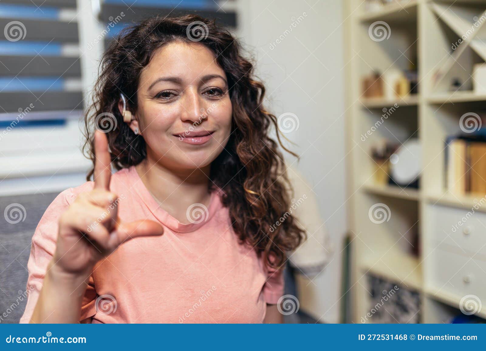 Deaf Woman Using Sign Language at Home Stock Photo - Image of indoors ...
