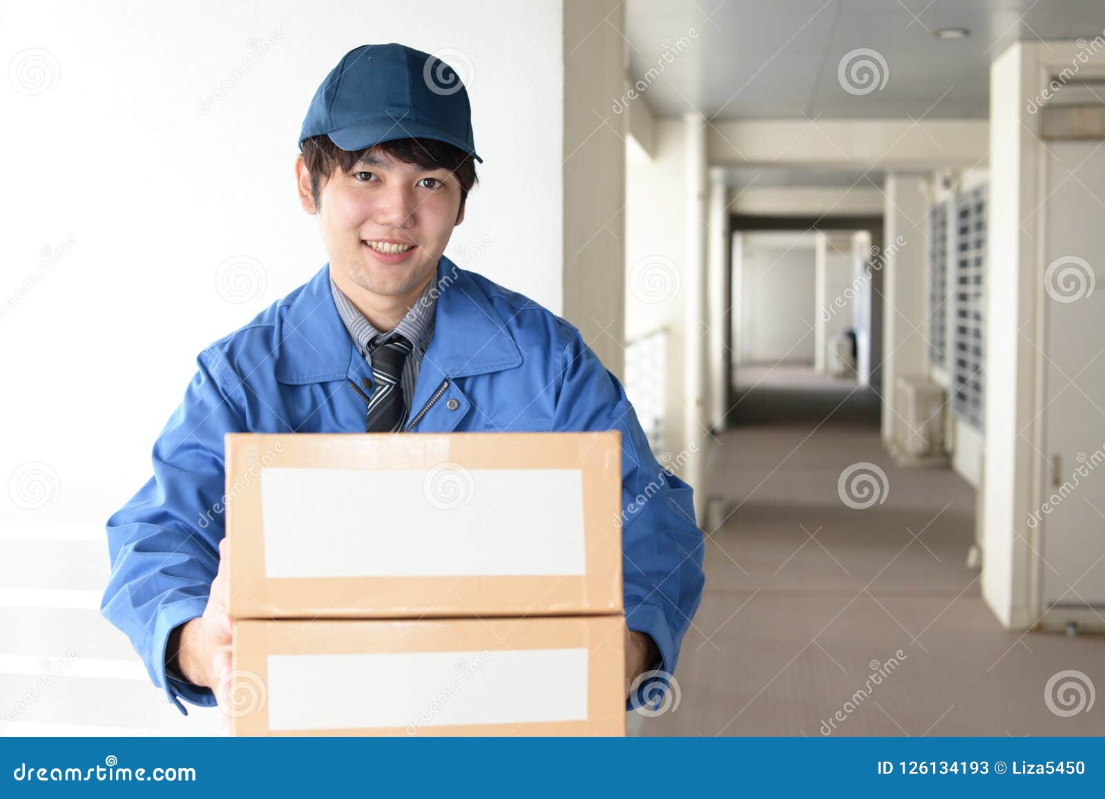 Smiling delivery man stock image. Image of beauty, delivery - 126134193