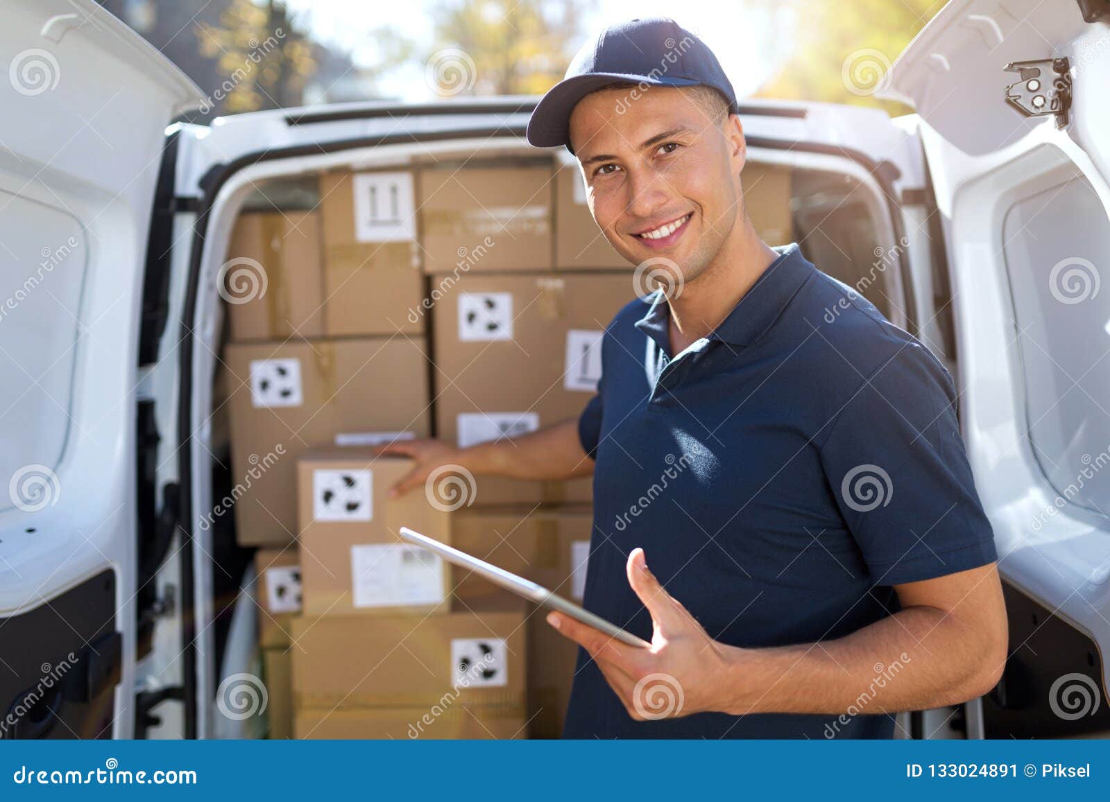 Courier Checking the Deliveries in His Van Stock Image - Image of ...