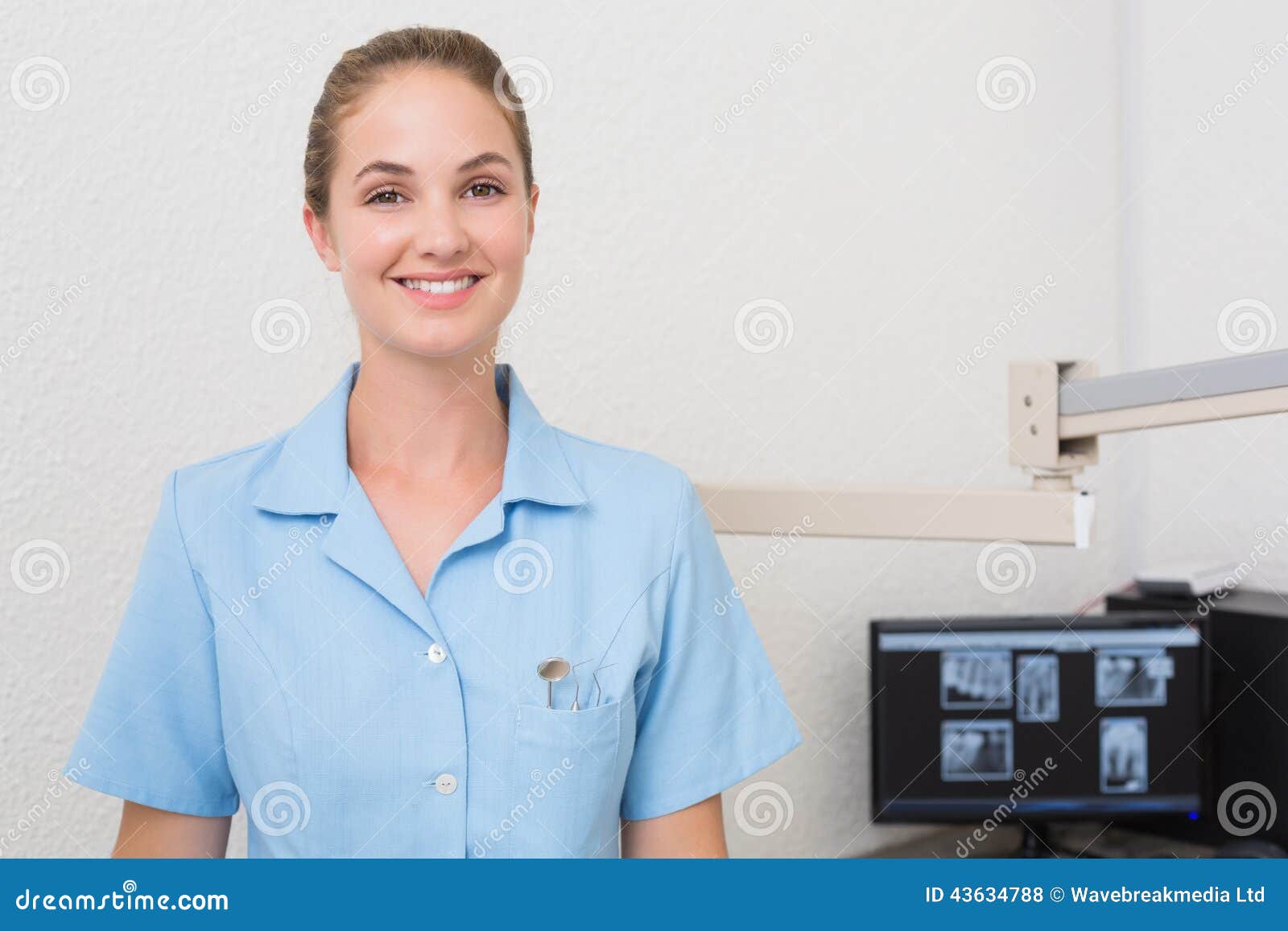 Smiling Dental Assistant Looking at Camera Stock Photo - Image of ...