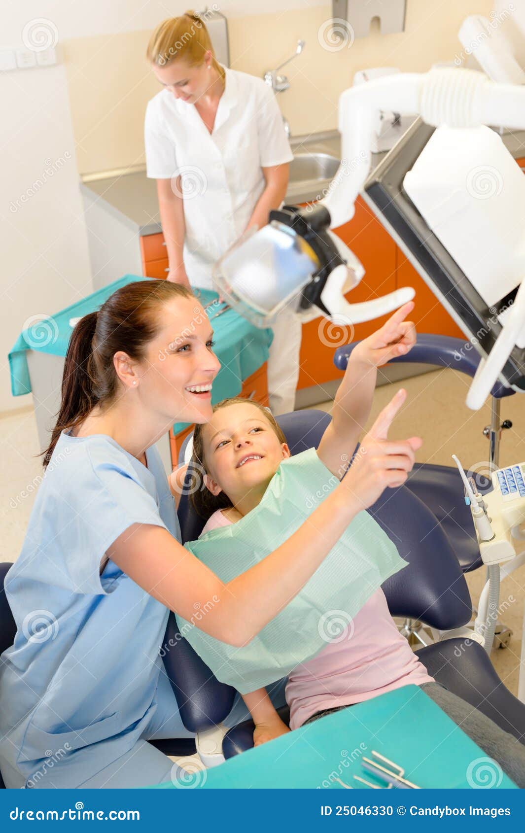 Smiling Dentist Pointing Finger On Toothbrush Stock Photo ...