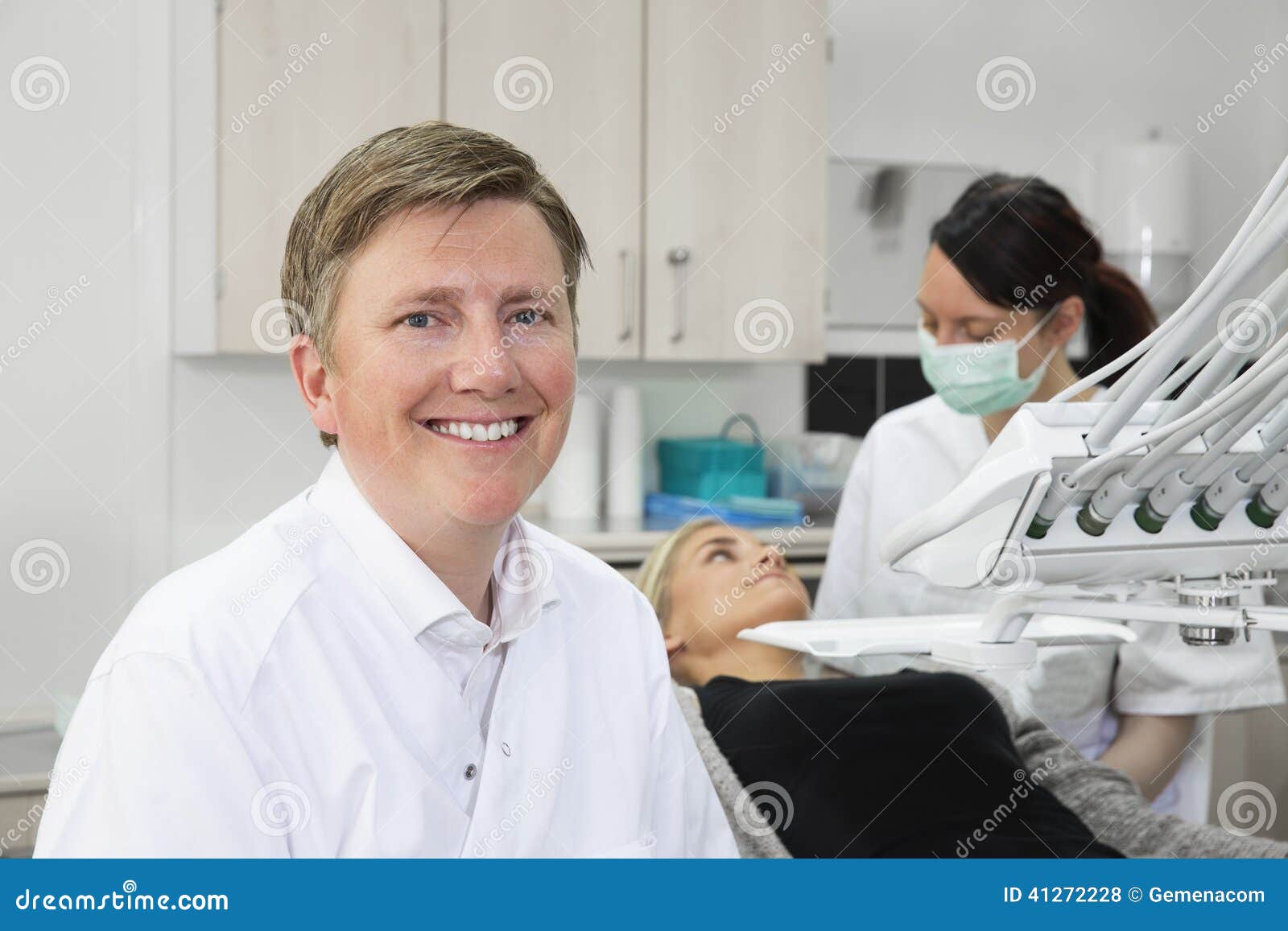 Smiling Dentist stock photo. Image of concentration, mirror - 41272228