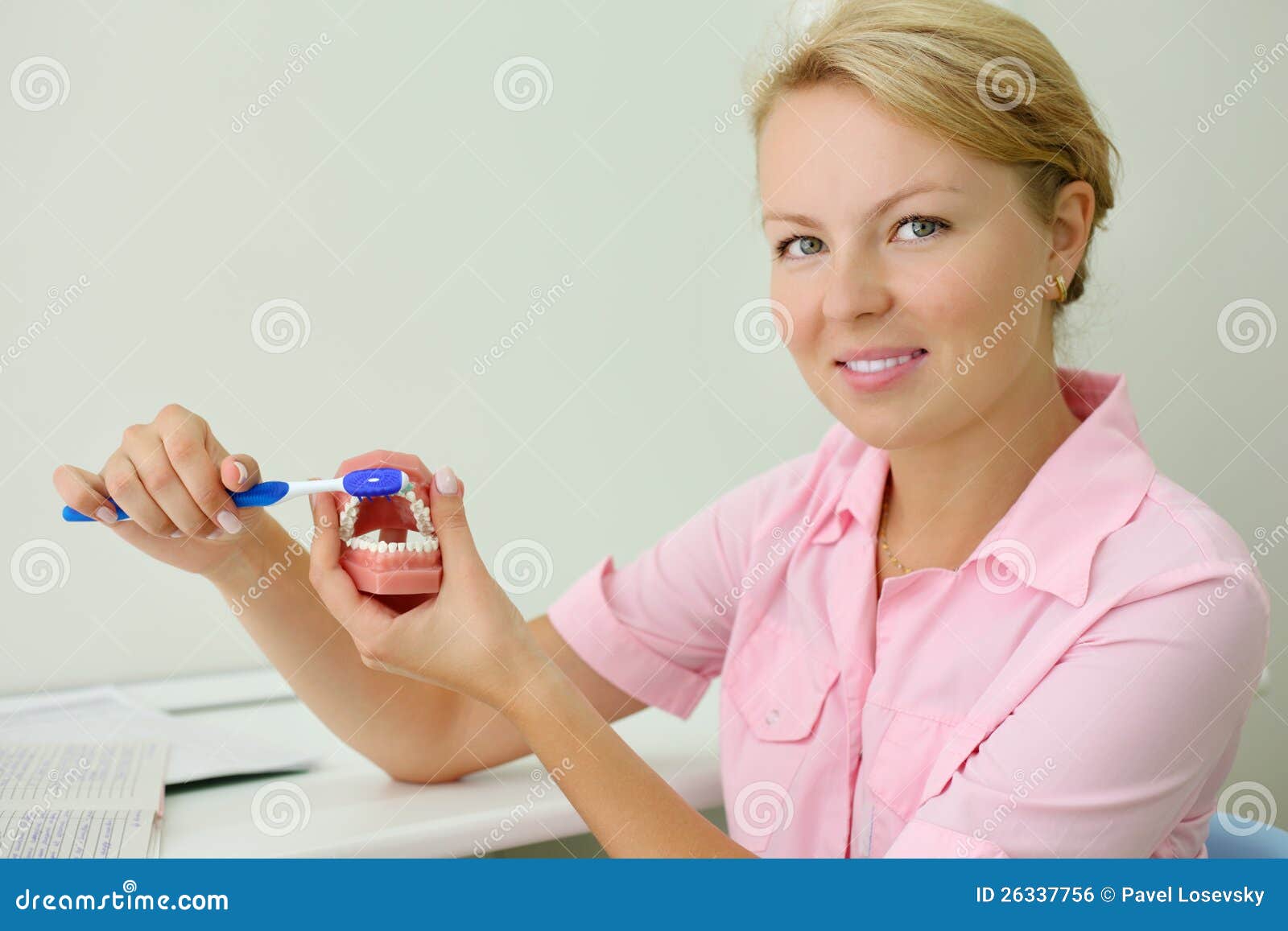 Smiling Dentist Pointing Finger On Toothbrush Stock Photo ...