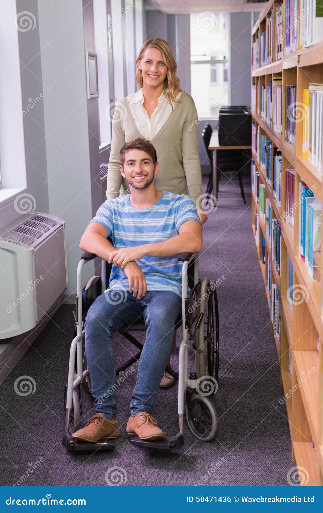 Smiling Disabled Student with Classmate in Library Stock Photo - Image ...