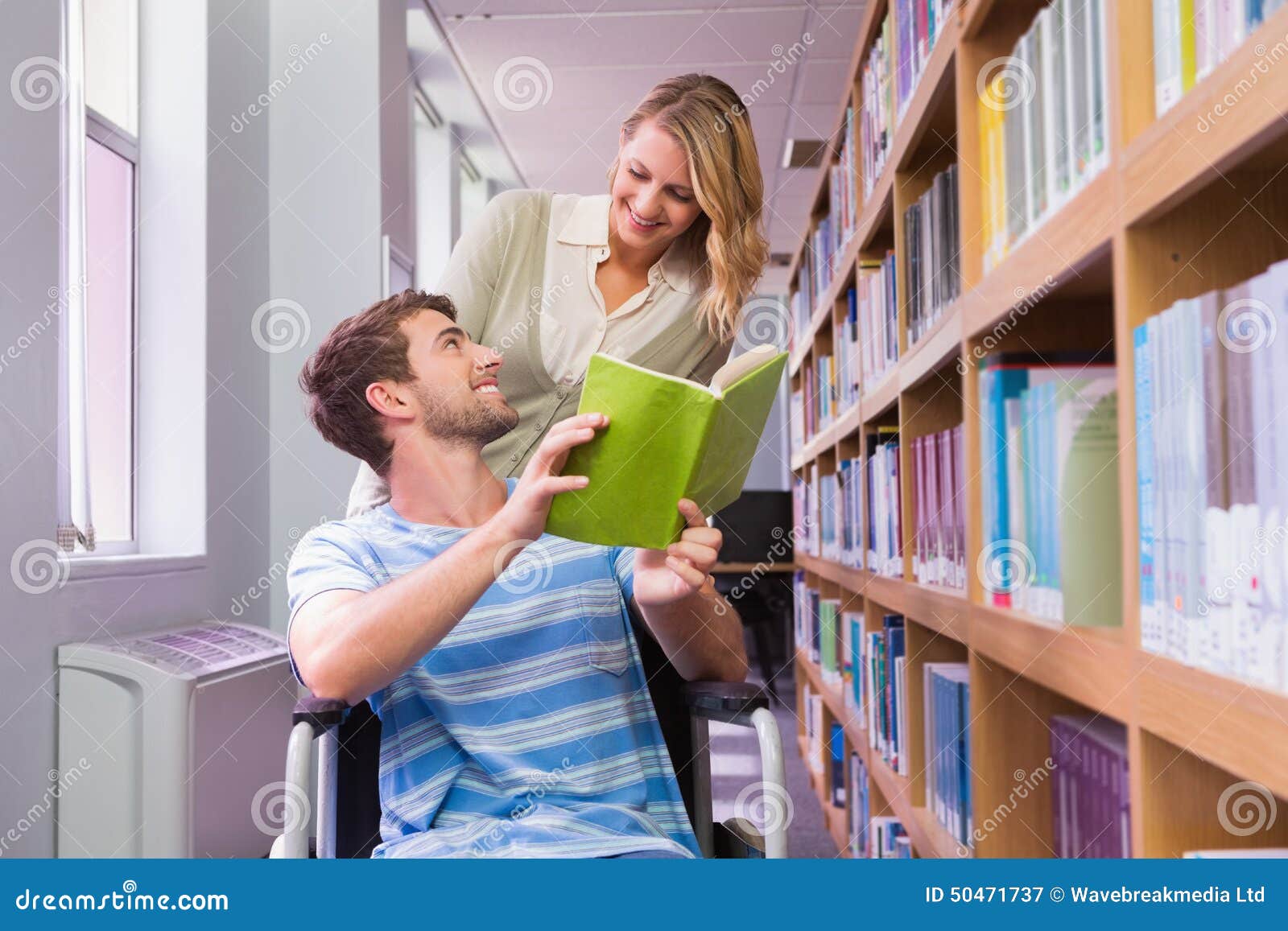 Smiling Disabled Student with Classmate in Library Stock Image - Image ...