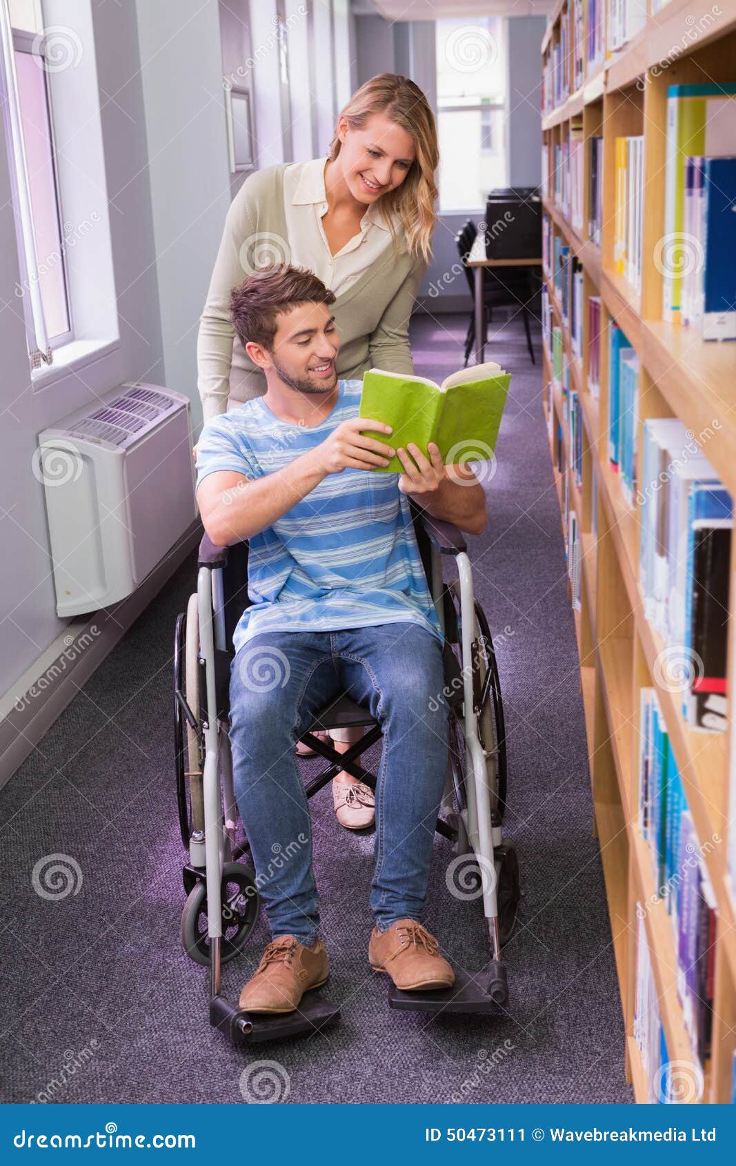 Smiling Disabled Student with Classmate in Library Stock Image - Image ...