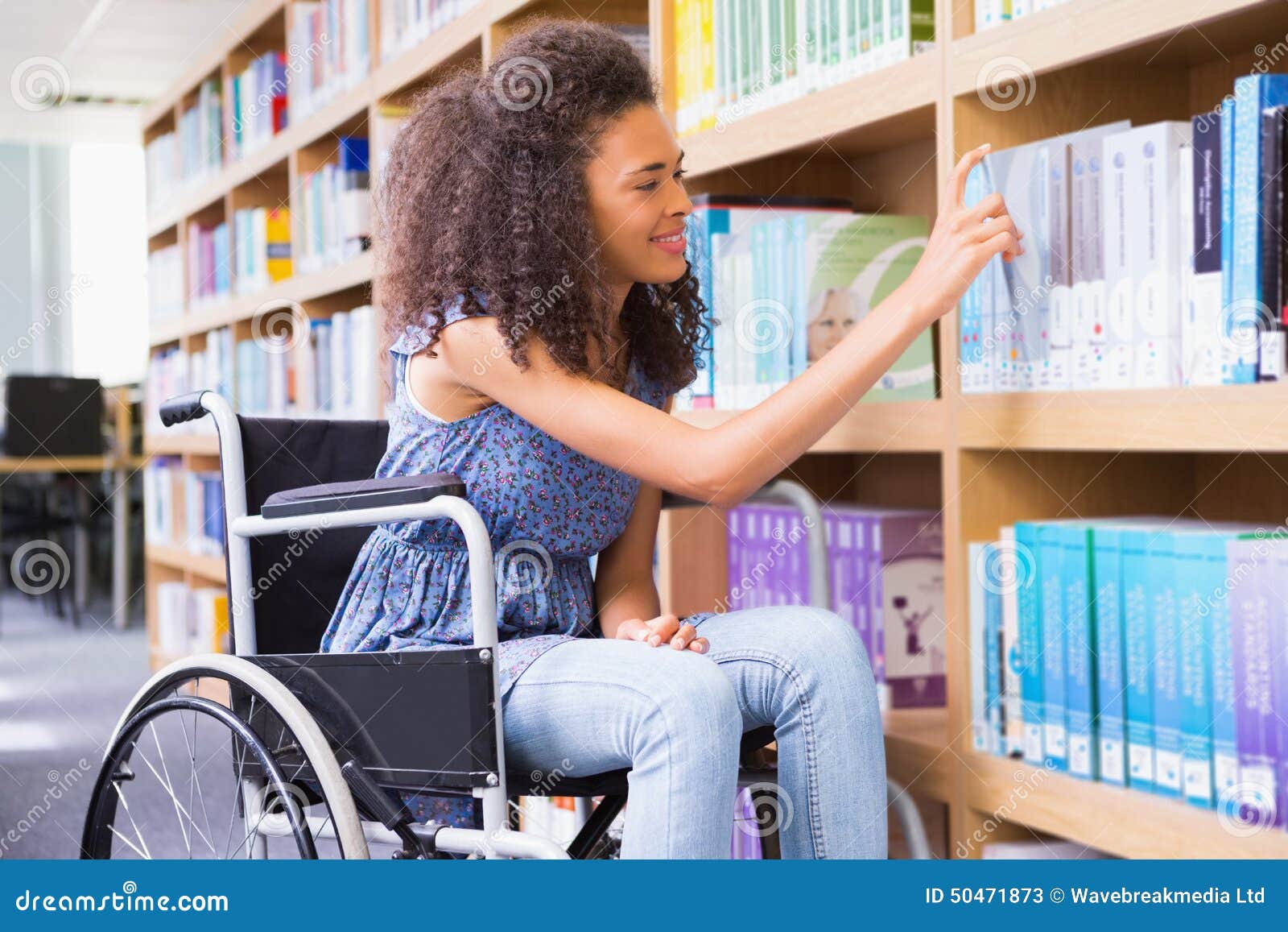 Smiling Disabled Student in Library Picking Book Stock Image - Image of ...