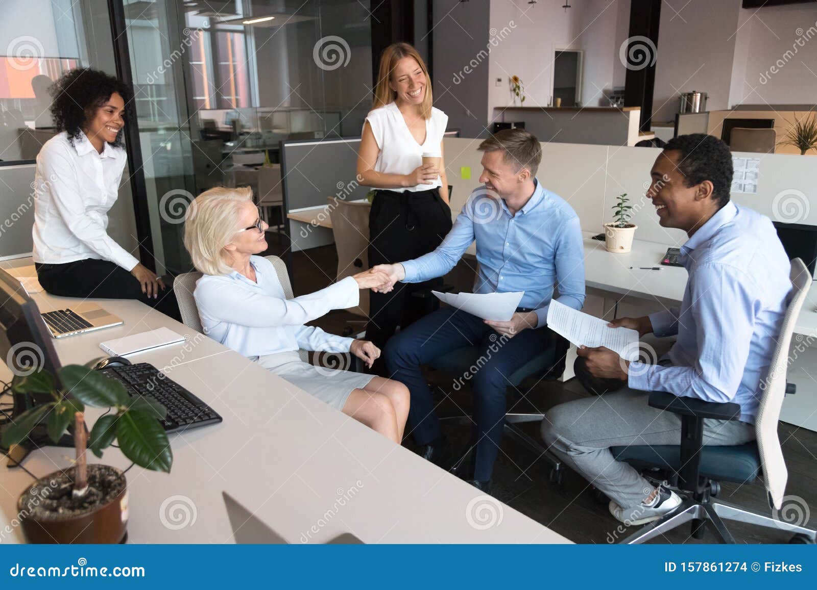Smiling Employees Handshake Getting Acquainted at Informal Meeting ... Smiling Employees Handshake Getting Acquainted at Informal Meeting ...