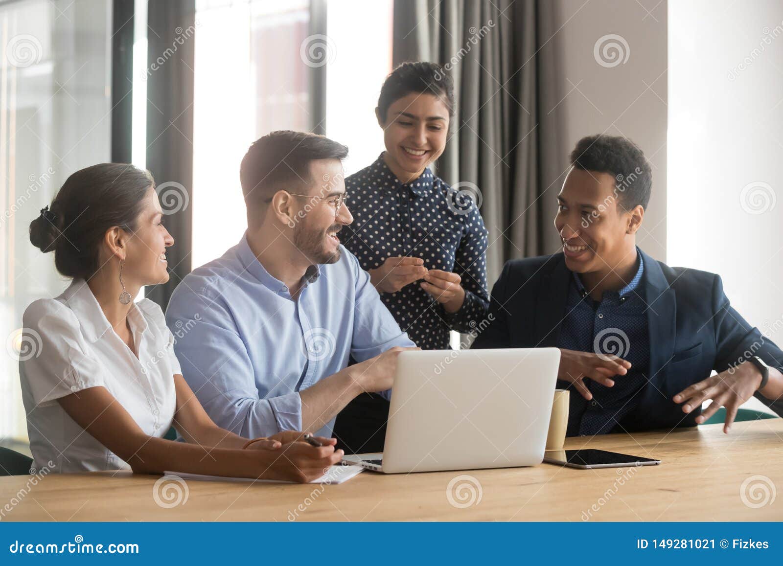 Smiling Diverse Employees Talk Brainstorming in Office Using Laptop ... Smiling Diverse Employees Talk Brainstorming in Office Using Laptop ...