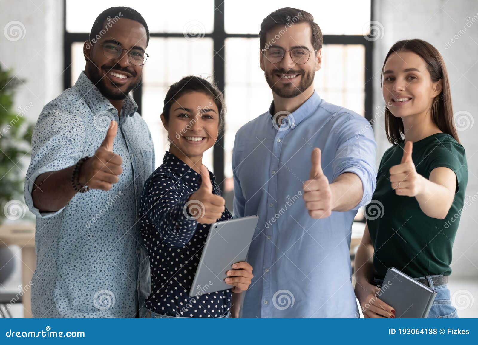 Smiling Diverse Employees Team Showing Thumbs Up at Camera Stock Photo ... Smiling Diverse Employees Team Showing Thumbs Up at Camera Stock Photo ...
