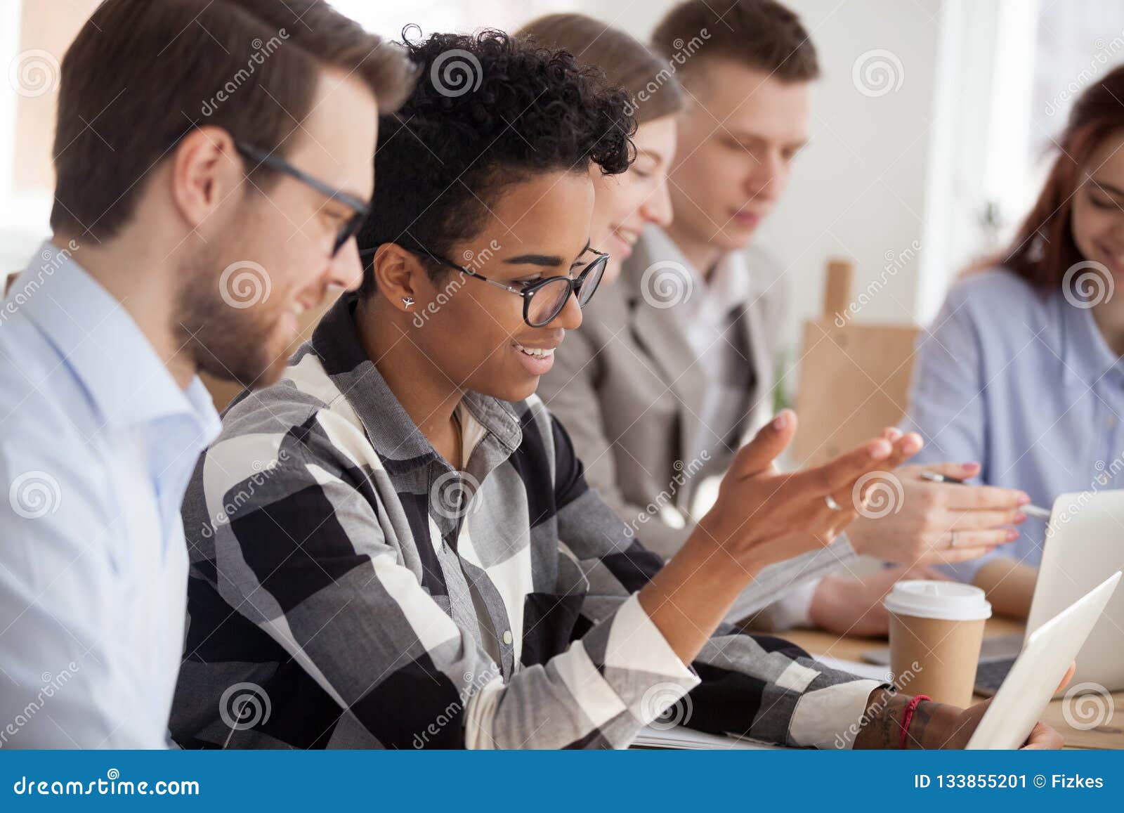 Smiling Diverse Employees Work at Laptops at Meeting Stock Image ... Smiling Diverse Employees Work at Laptops at Meeting Stock Image ...