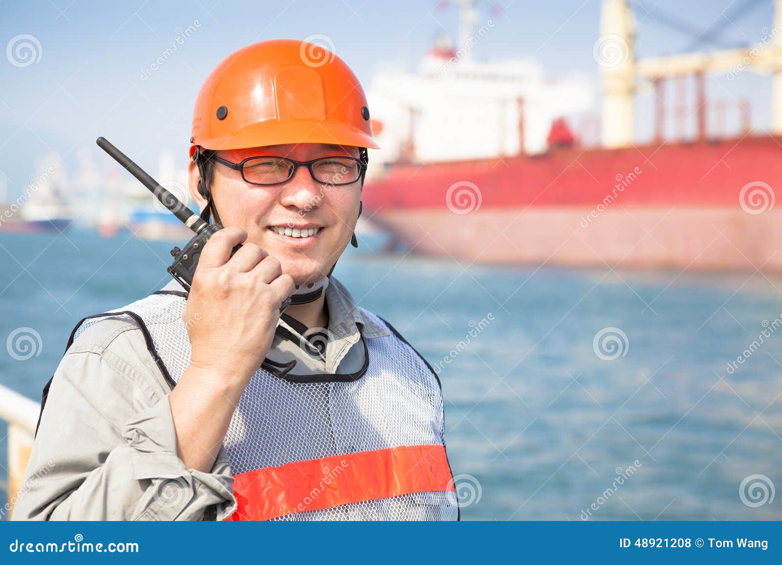 Smiling Dock Worker Holding Radio Stock Photo - Image of loading ...