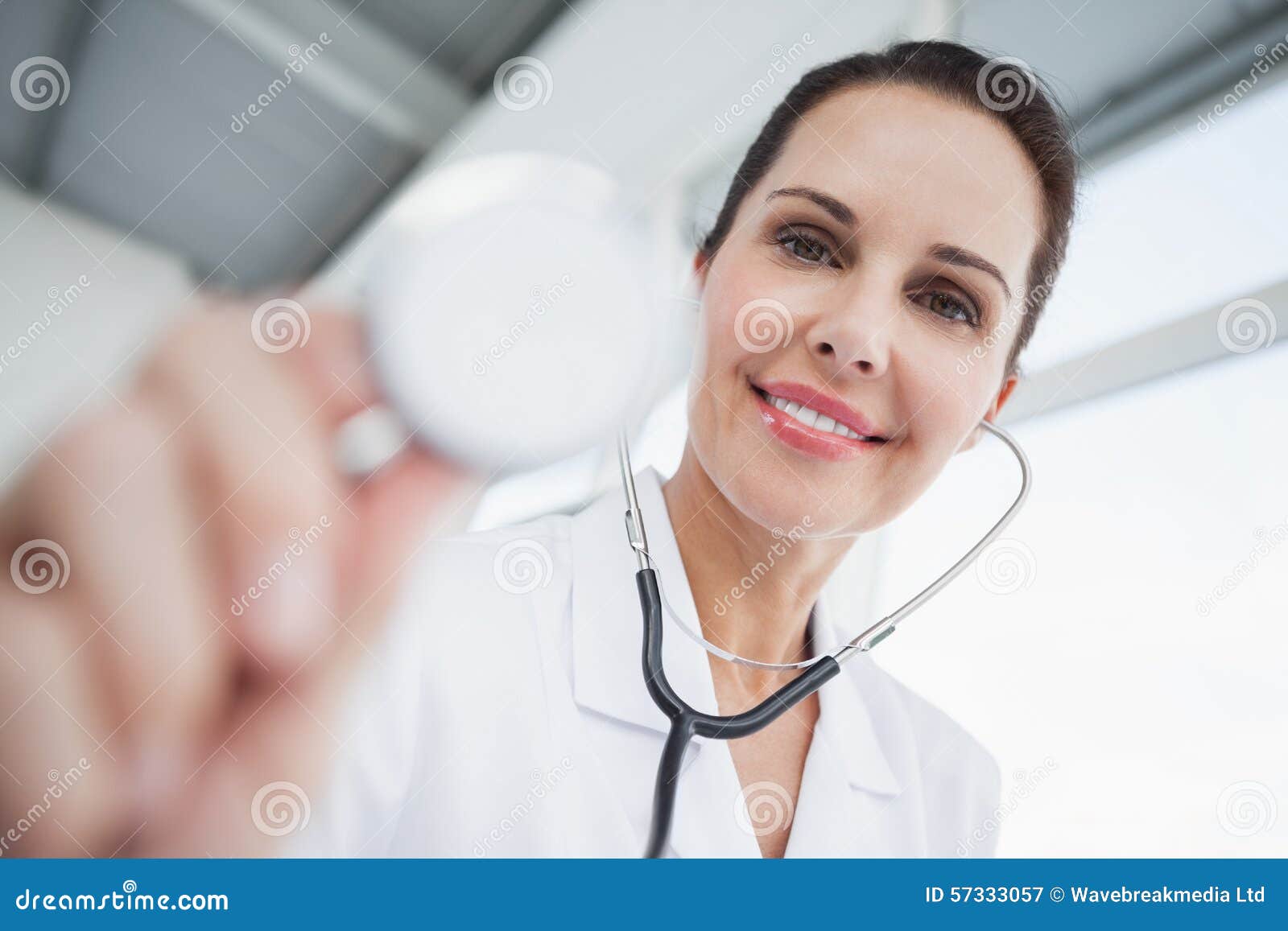 Smiling Doctor Checking a Heartbeat Stock Image - Image of clinic ...