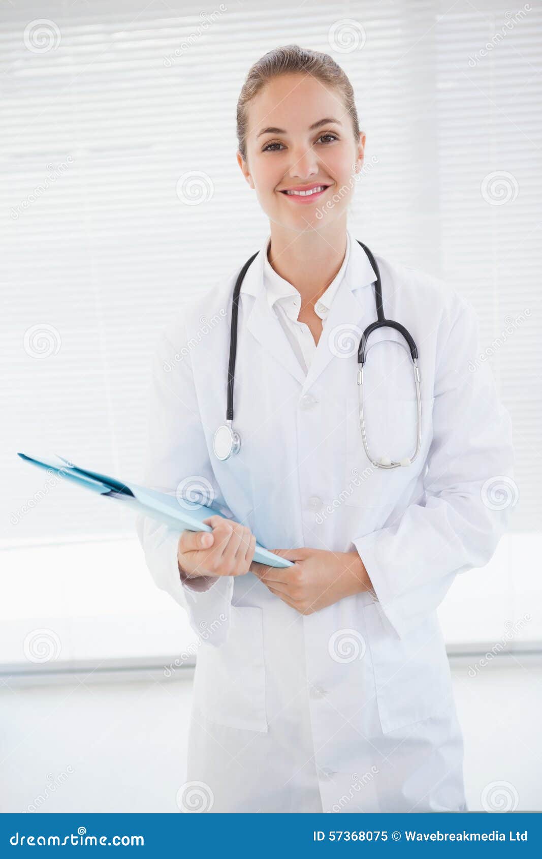 Smiling Doctor Holding Some Files Stock Image - Image of front ...