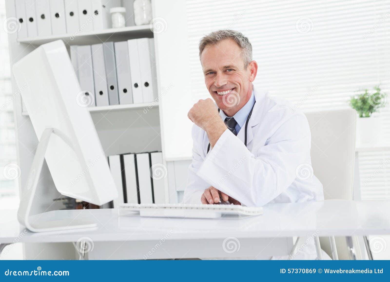 Smiling Doctor Looking at Camera Stock Image - Image of camera, side ...