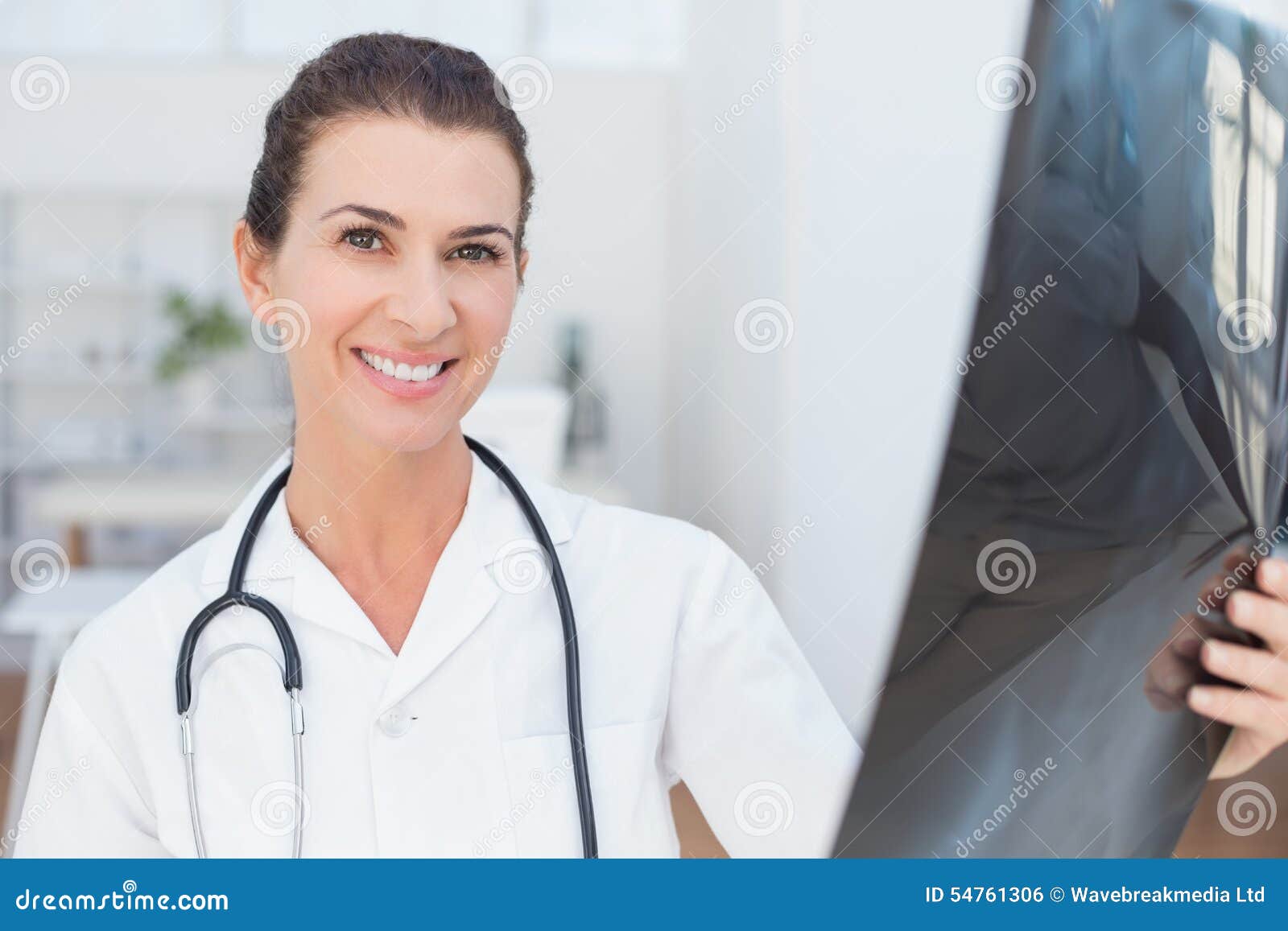 Smiling Doctor Looking at Camera with Xray Stock Photo - Image of ...