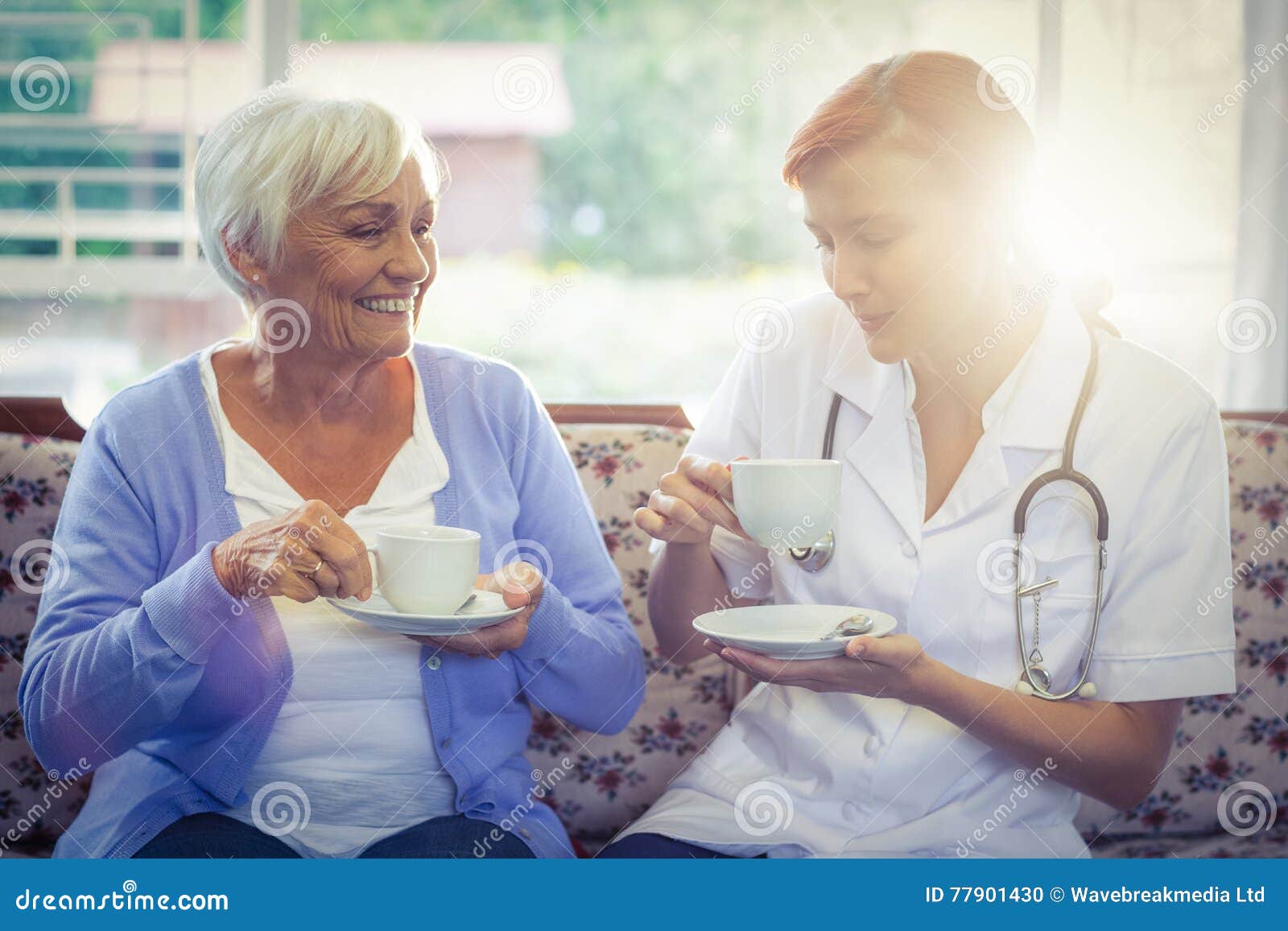 Smiling Doctor and Patient Having Tea Stock Photo - Image of homey ...