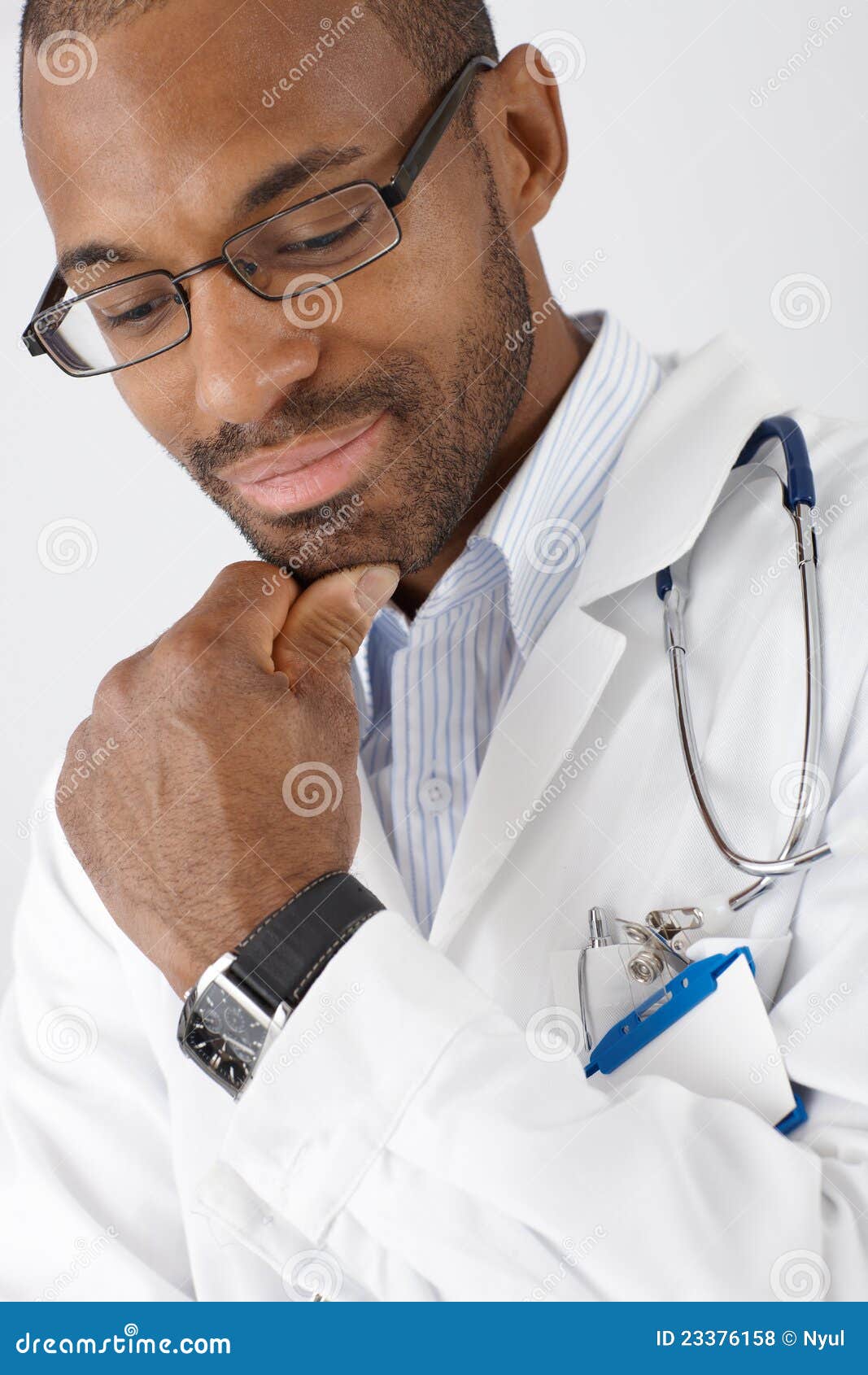 Smiling doctor thinking stock photo. Image of american - 23376158