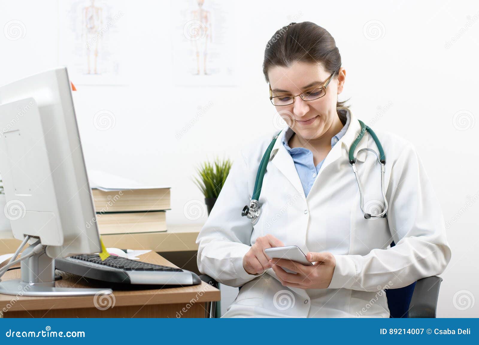 Smiling Doctor Using Smartphone Stock Image - Image of cellphone, cell ...