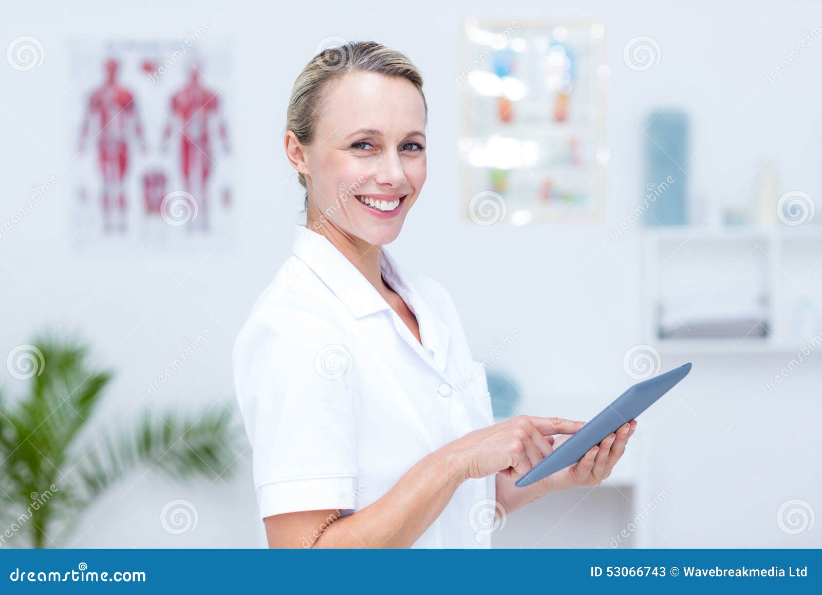 Smiling Doctor Using Tablet Stock Image - Image of practitioner, clinic ...
