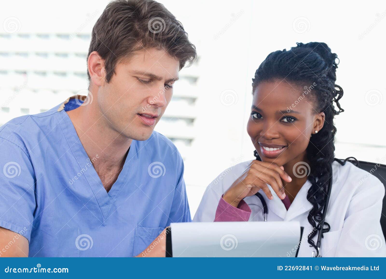 Smiling Doctors Looking at a Document Stock Image - Image of health ...