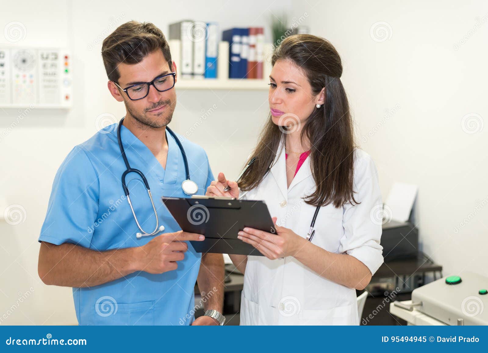 Smiling doctors posing stock image. Image of file, confident - 95494945