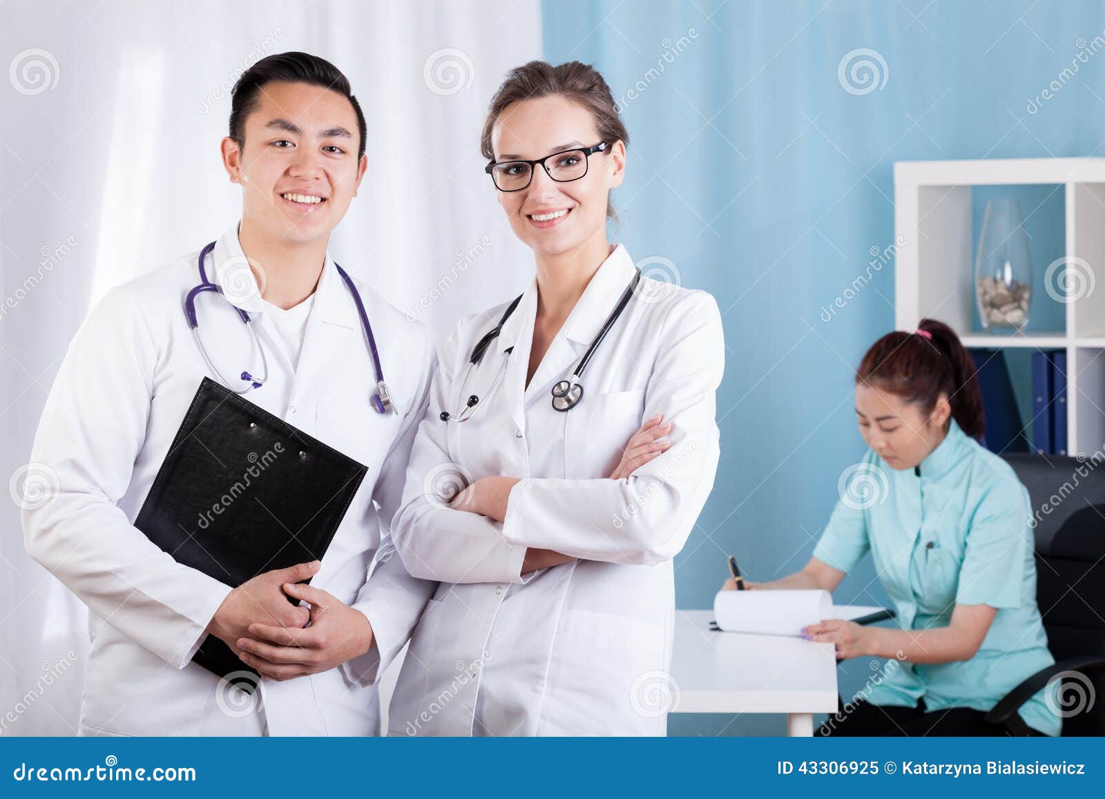 Smiling doctors team stock image. Image of physician - 43306925