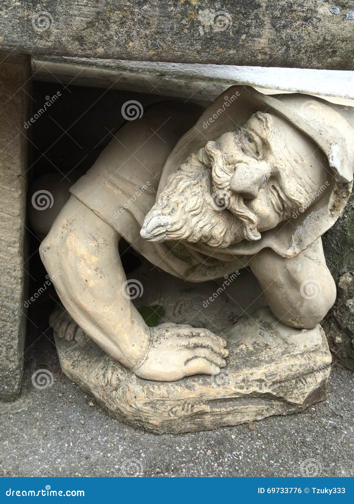 Smiling Dwarf Statue Under a Block of Stone Stock Photo - Image of ...