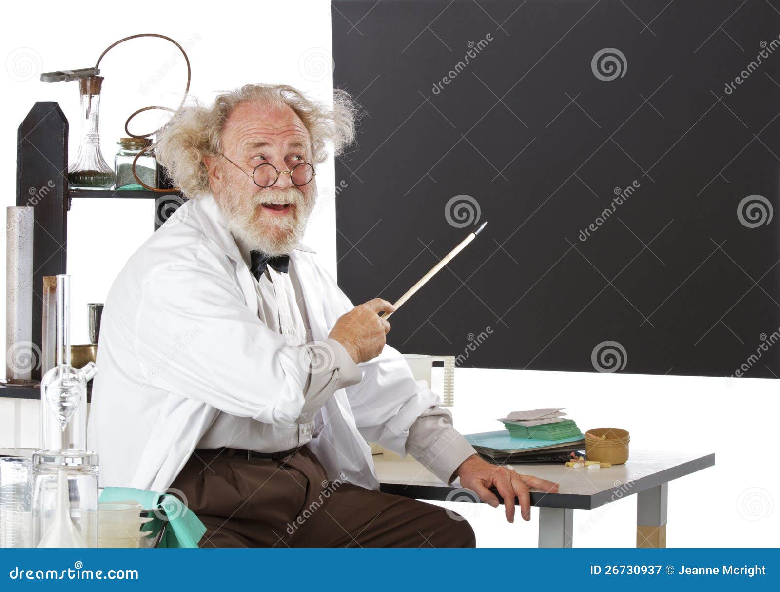 Smiling Eccentric Scientist Points To Blackboard Stock Image - Image of ...