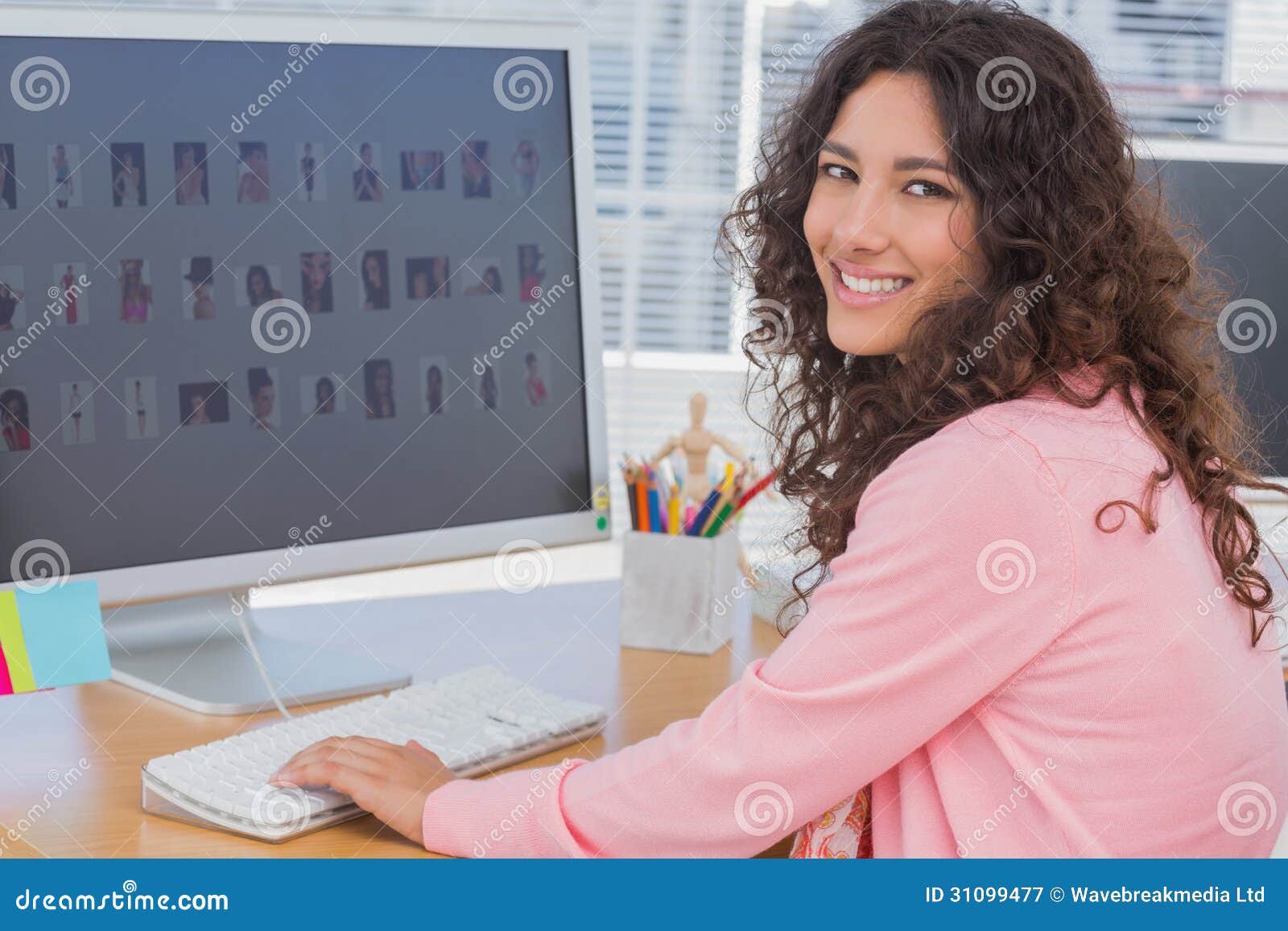 Smiling editor at her desk stock image. Image of editor - 31099477
